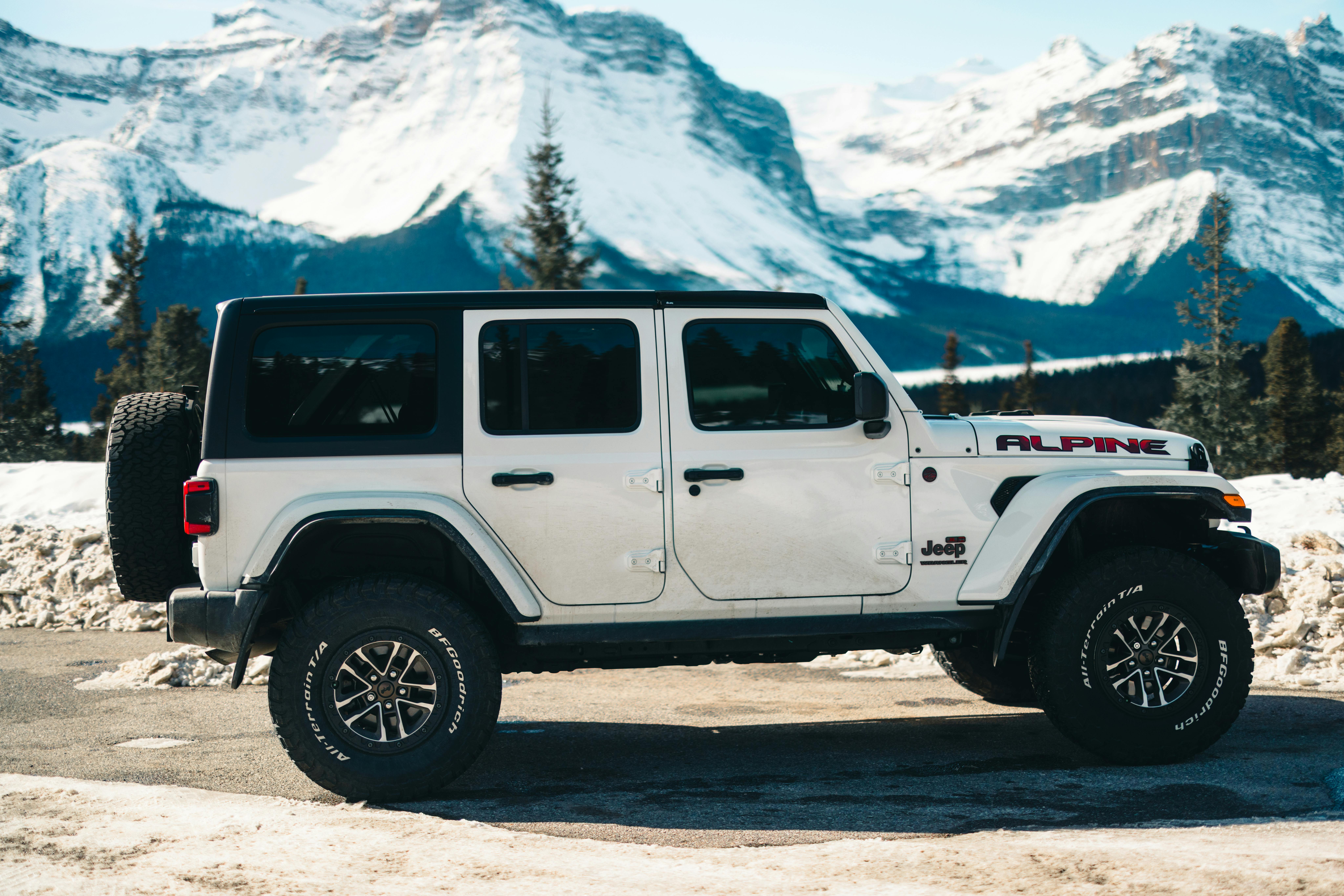 Jeep Wrangler Adventure in Snowy Canadian Rockies · Free Stock Photo