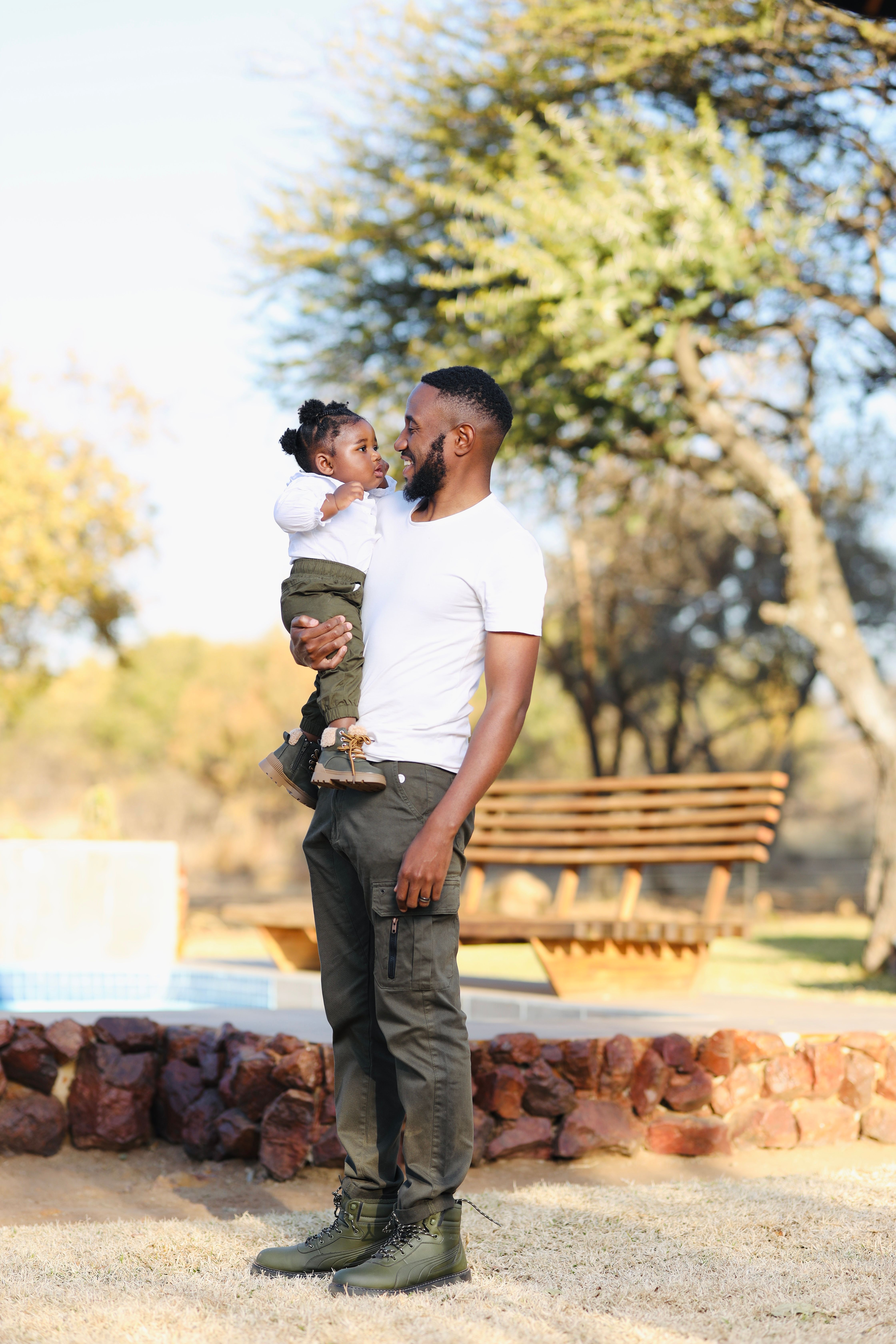 Father and child bonding outdoors in nature · Free Stock Photo