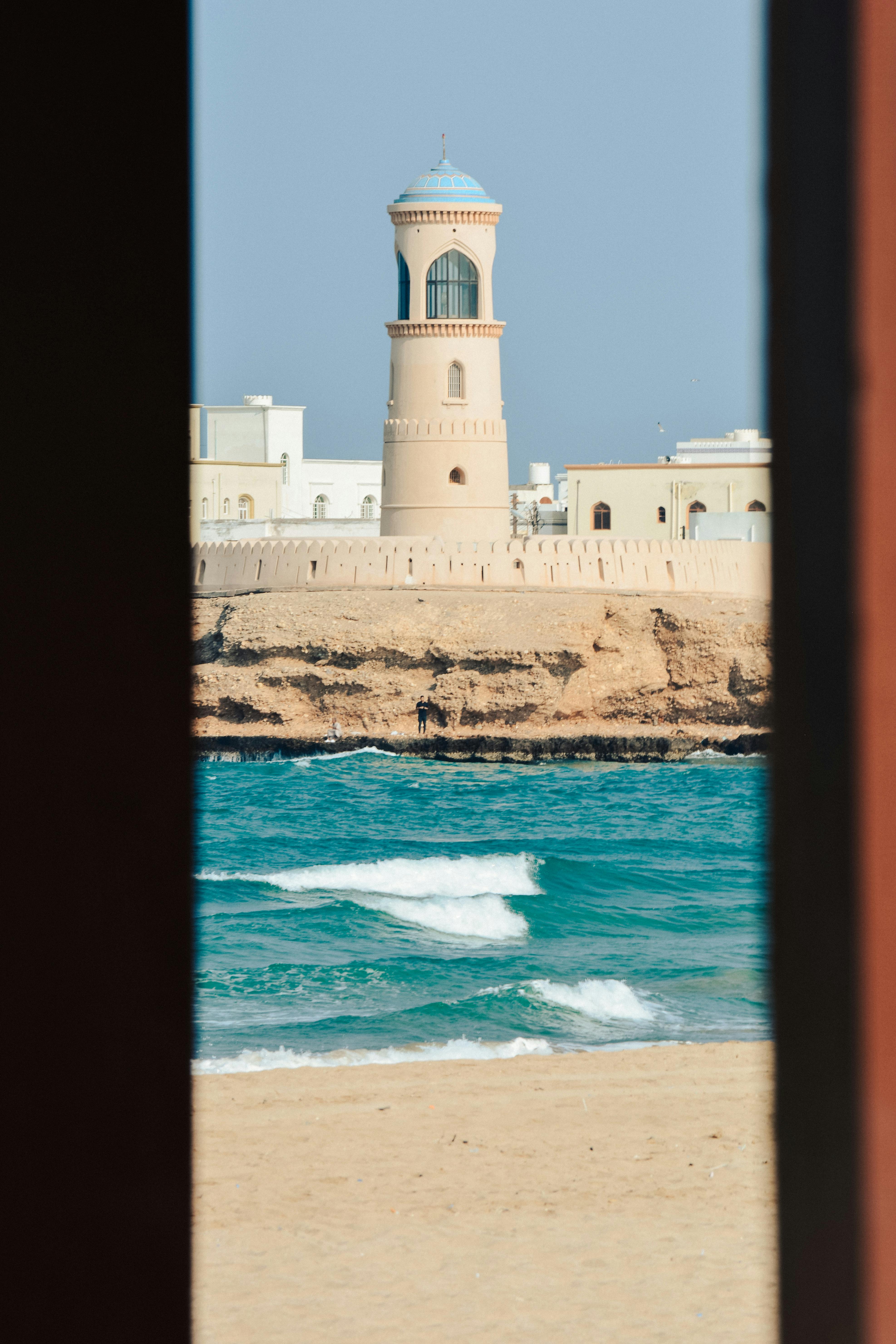 Lighthouse View in Muscat, Oman Coastal Scene · Free Stock Photo