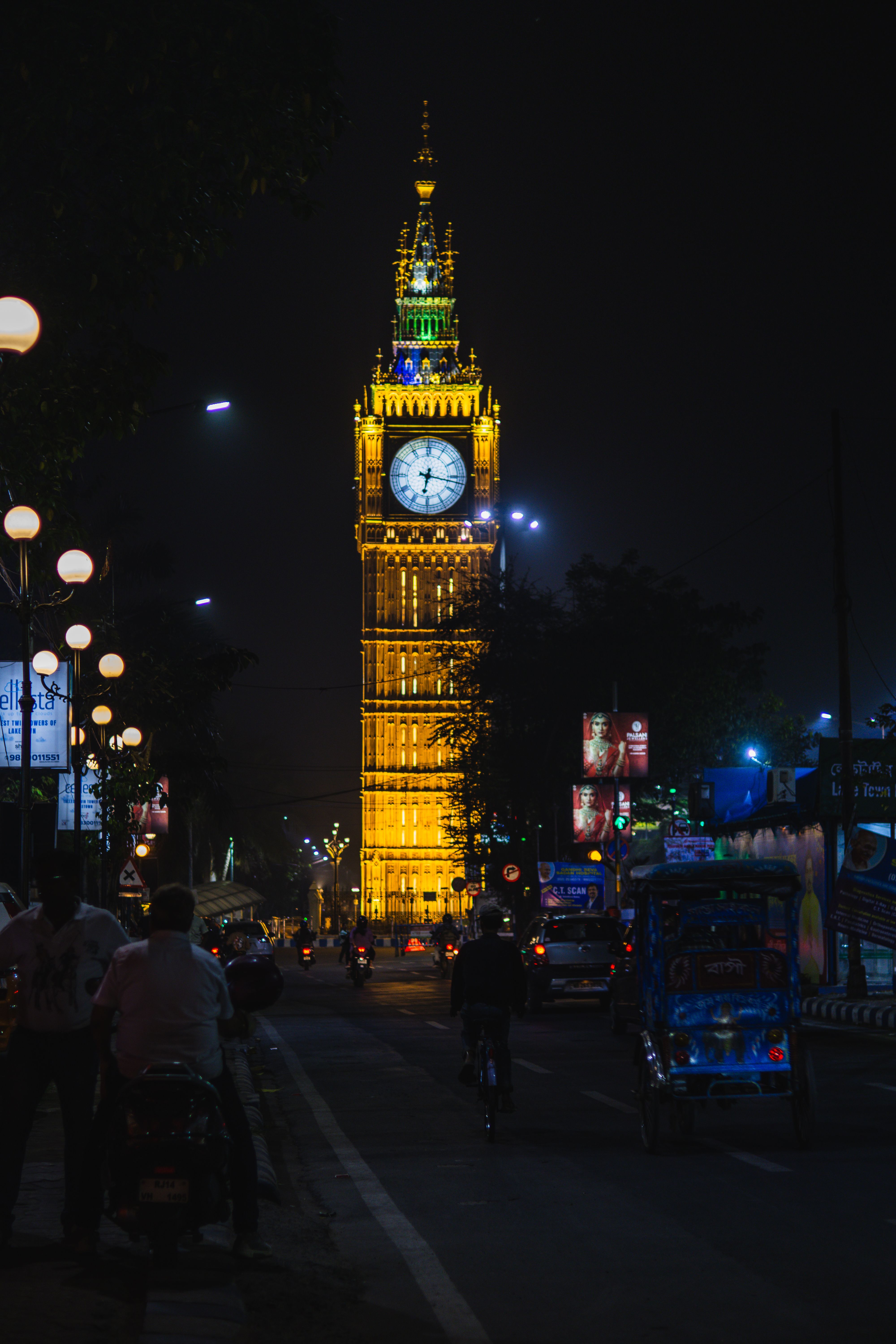 Iconic Lighted Clock Tower at Night · Free Stock Photo
