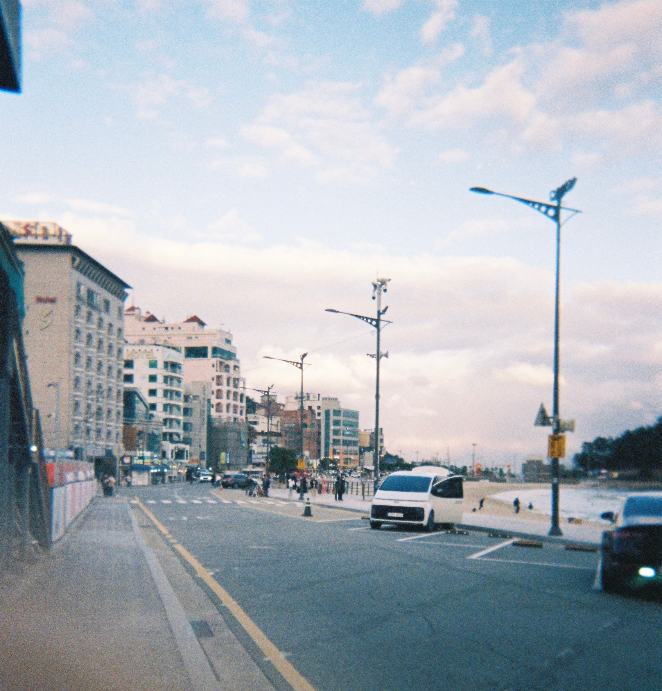 Coastal City Street with Beachfront Architecture · Free Stock Photo