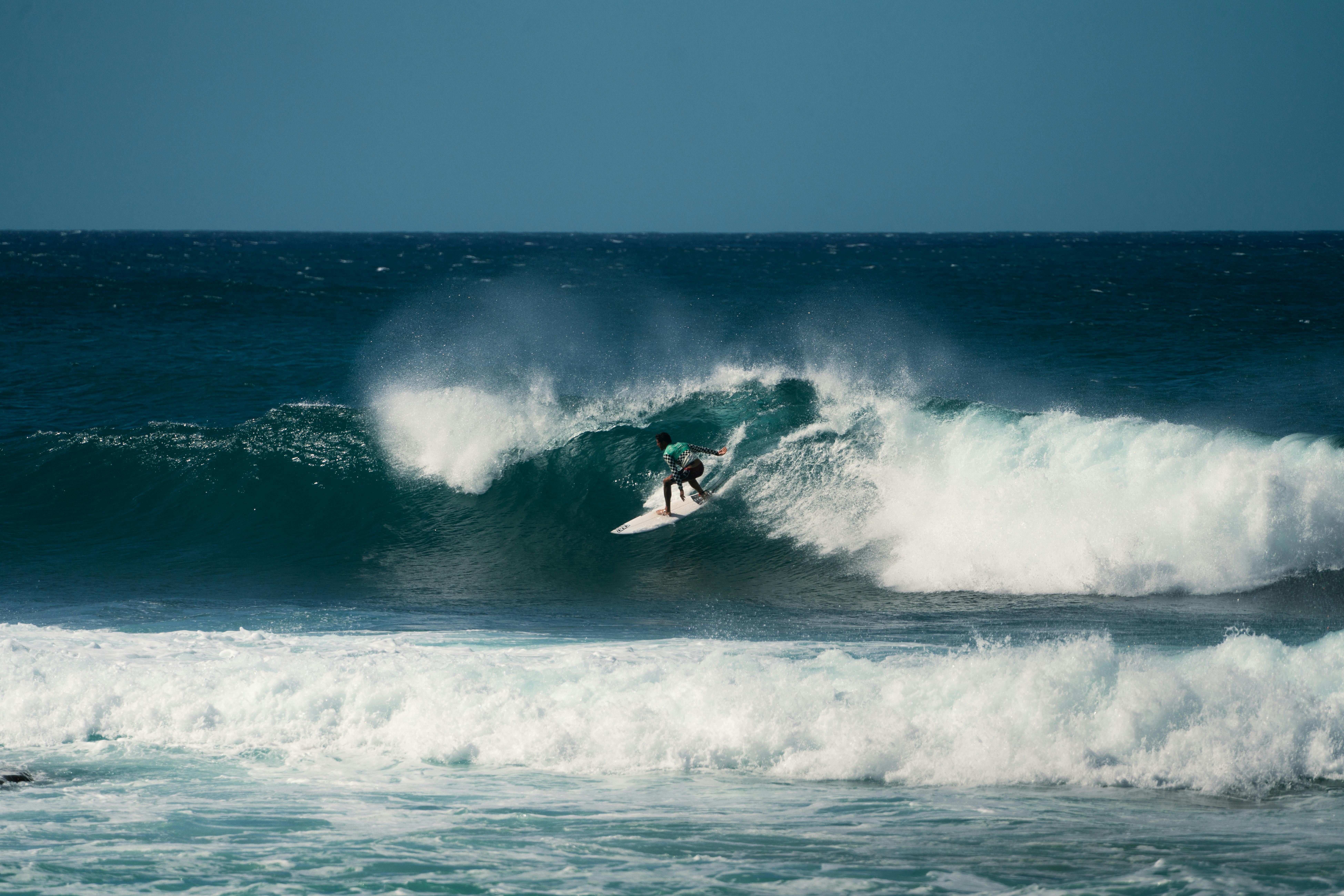 Exciting Surfing Adventure on Large Ocean Wave · Free Stock Photo