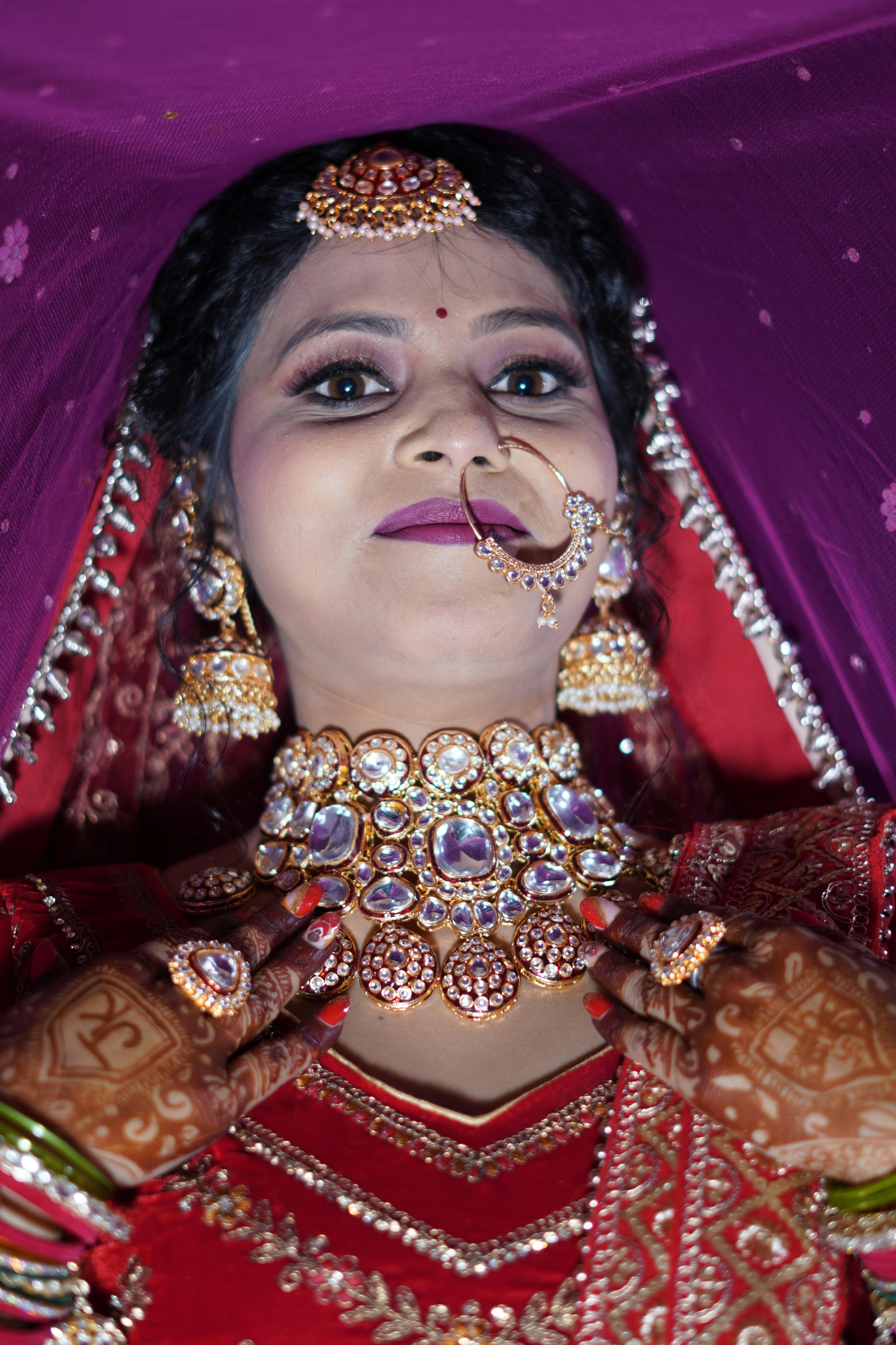 Indian Bride in Traditional Attire with Jewelry · Free Stock Photo