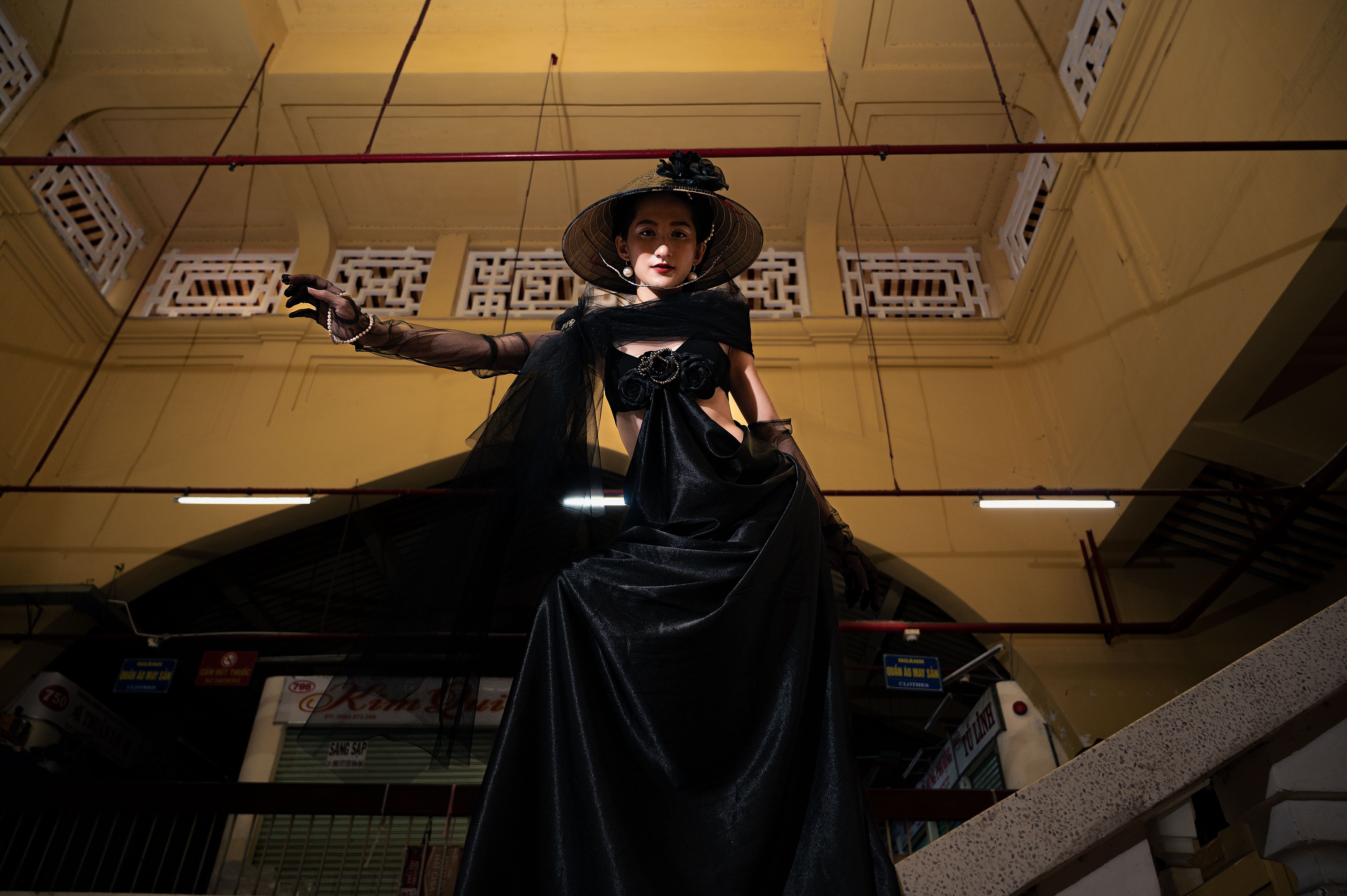 Elegant Woman in Dramatic Black Gown Indoors · Free Stock Photo