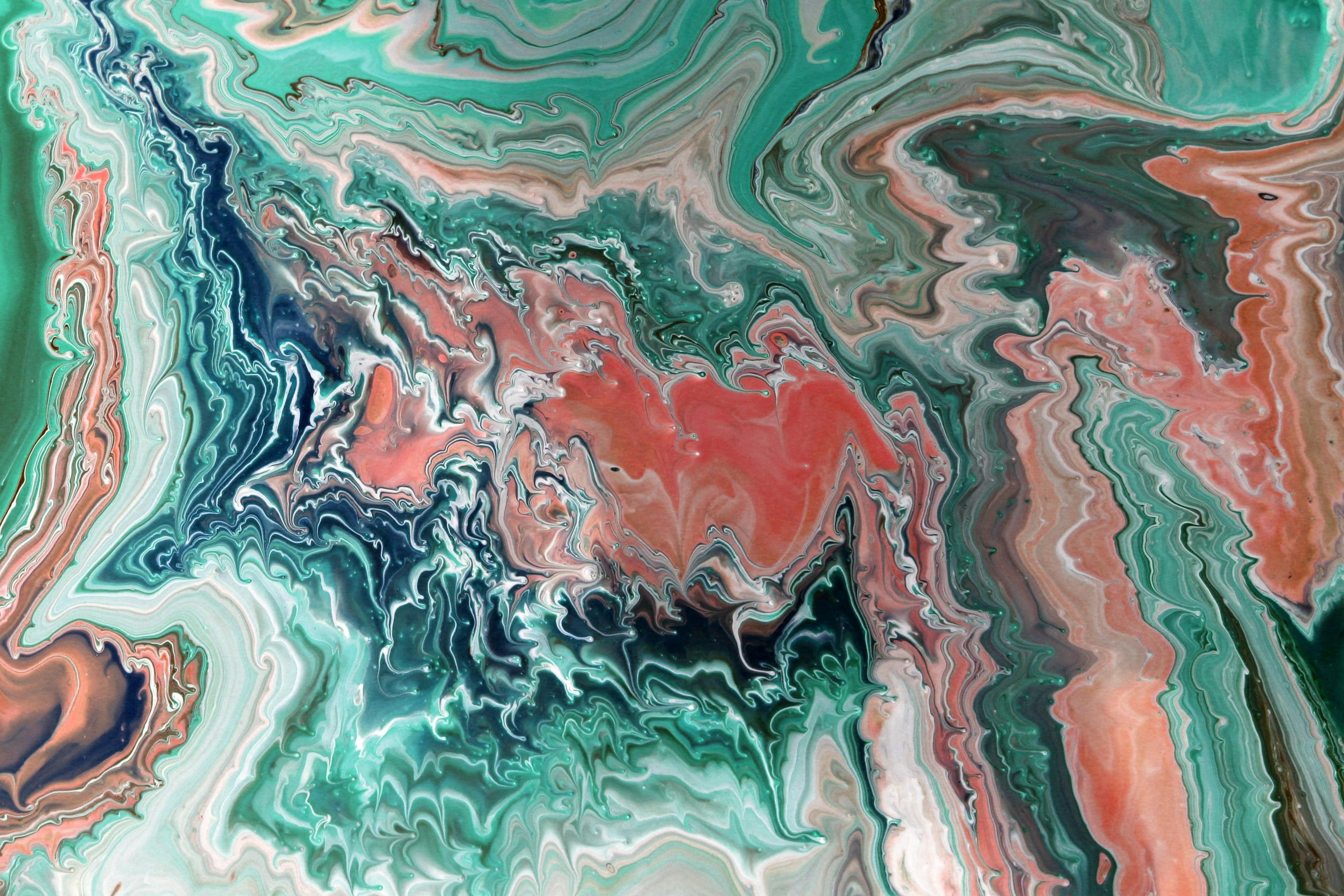 Vibrant Abstract Paint Swirl Art in Green and Coral · Free Stock Photo
