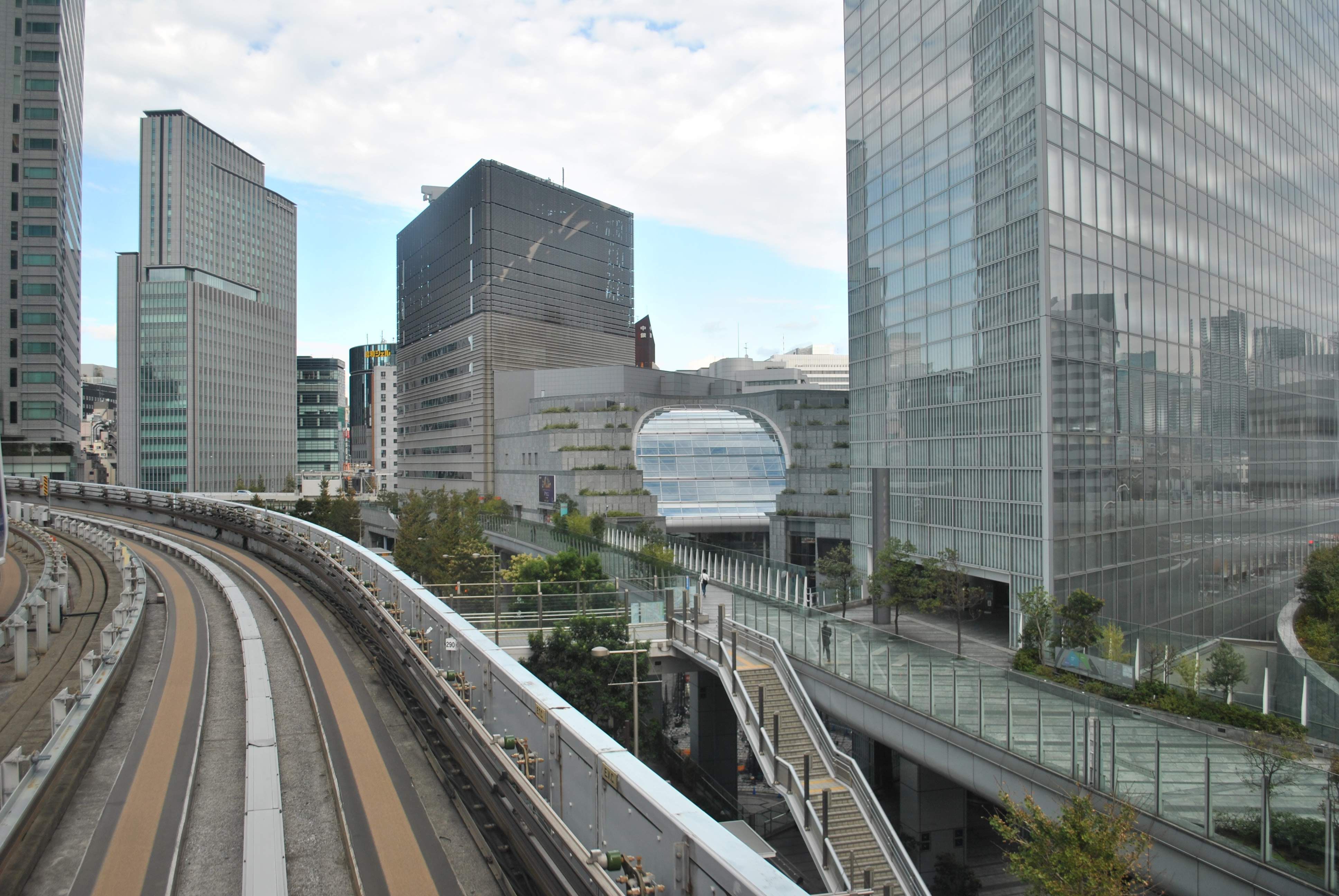 Modern Urban Cityscape with Elevated Train Track · Free Stock Photo