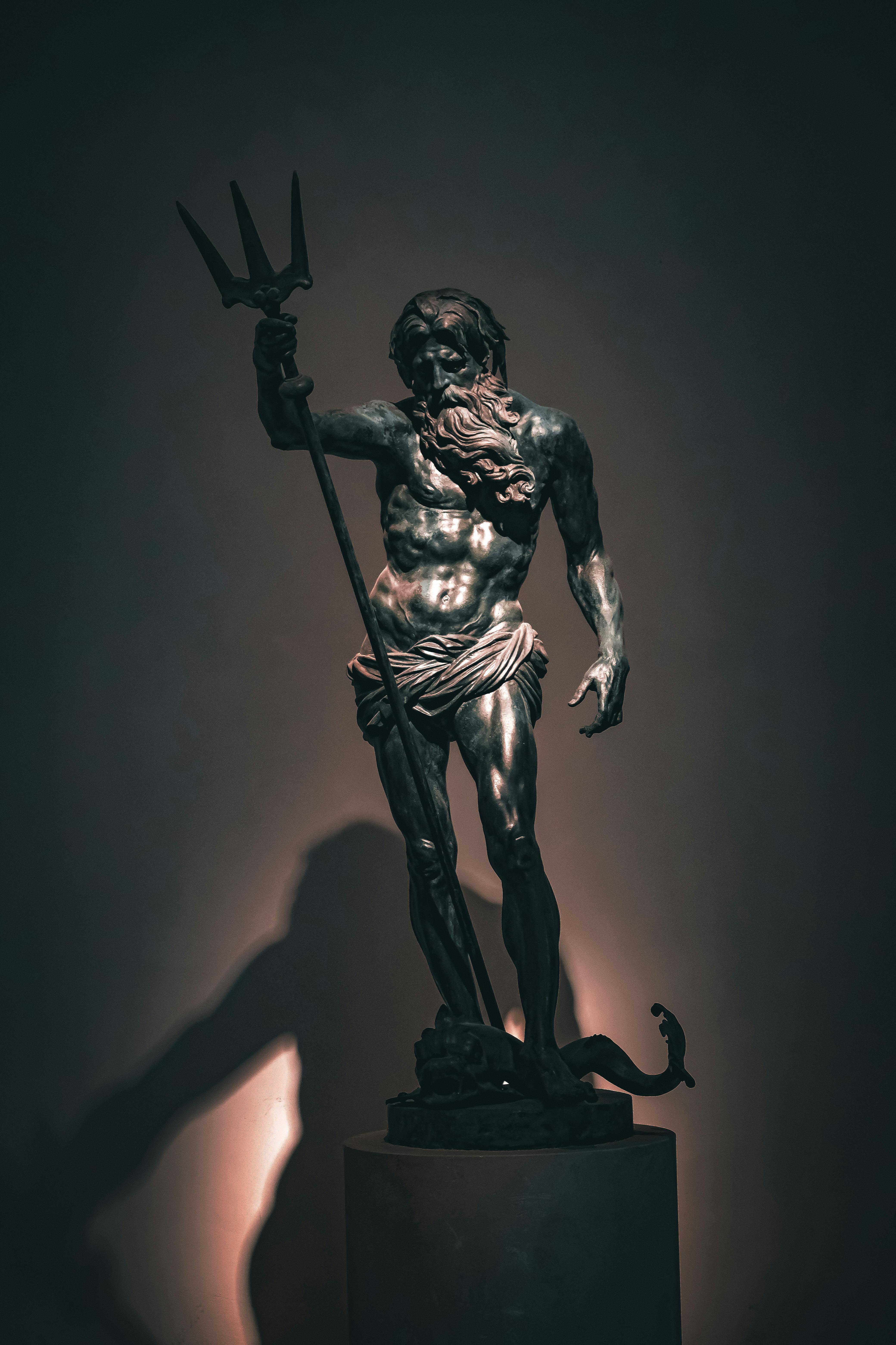 Dramatic Bronze Statue of Poseidon with Trident · Free Stock Photo