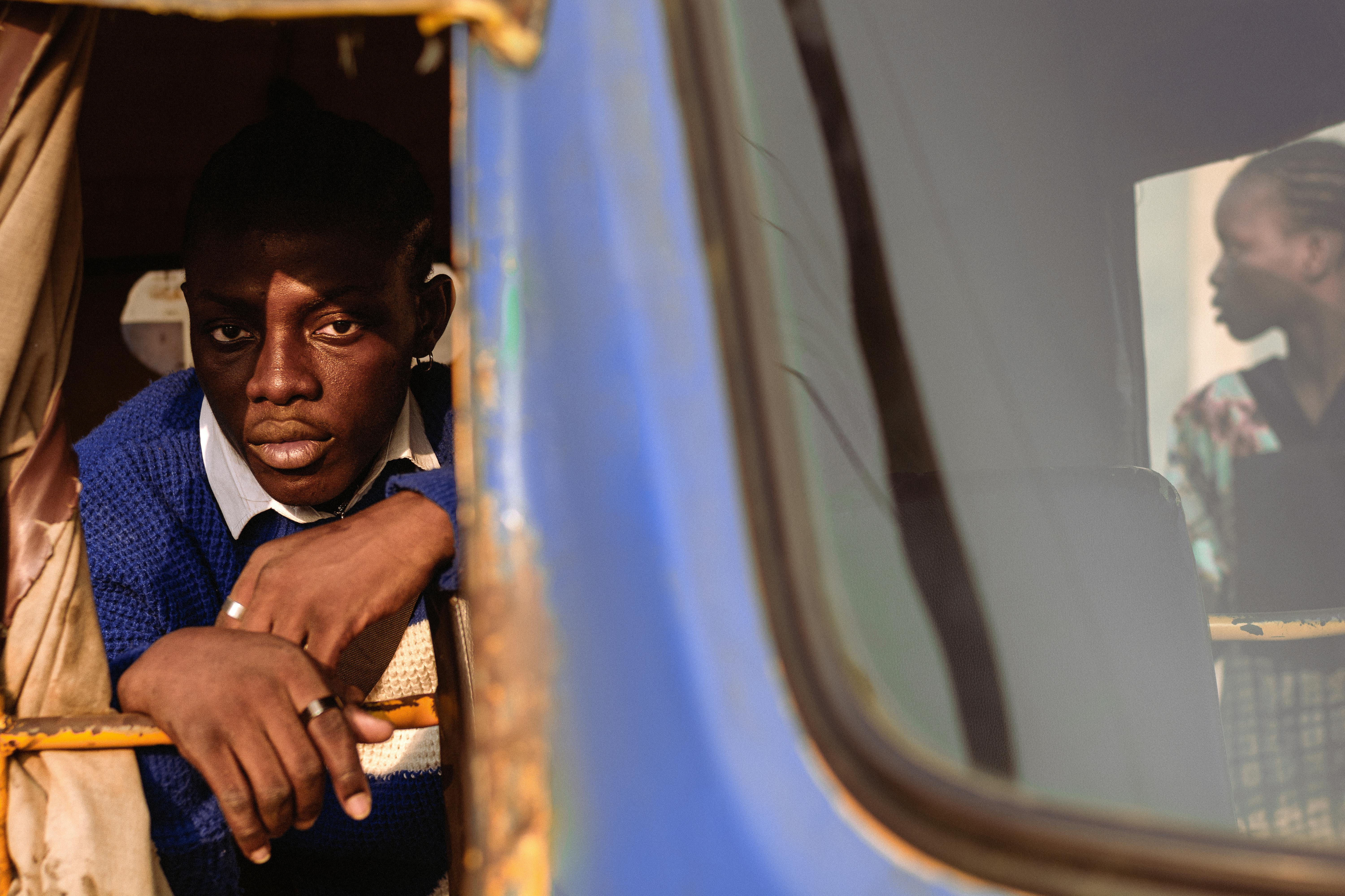 Thoughtful Portrait of Man in Lagos Bus · Free Stock Photo