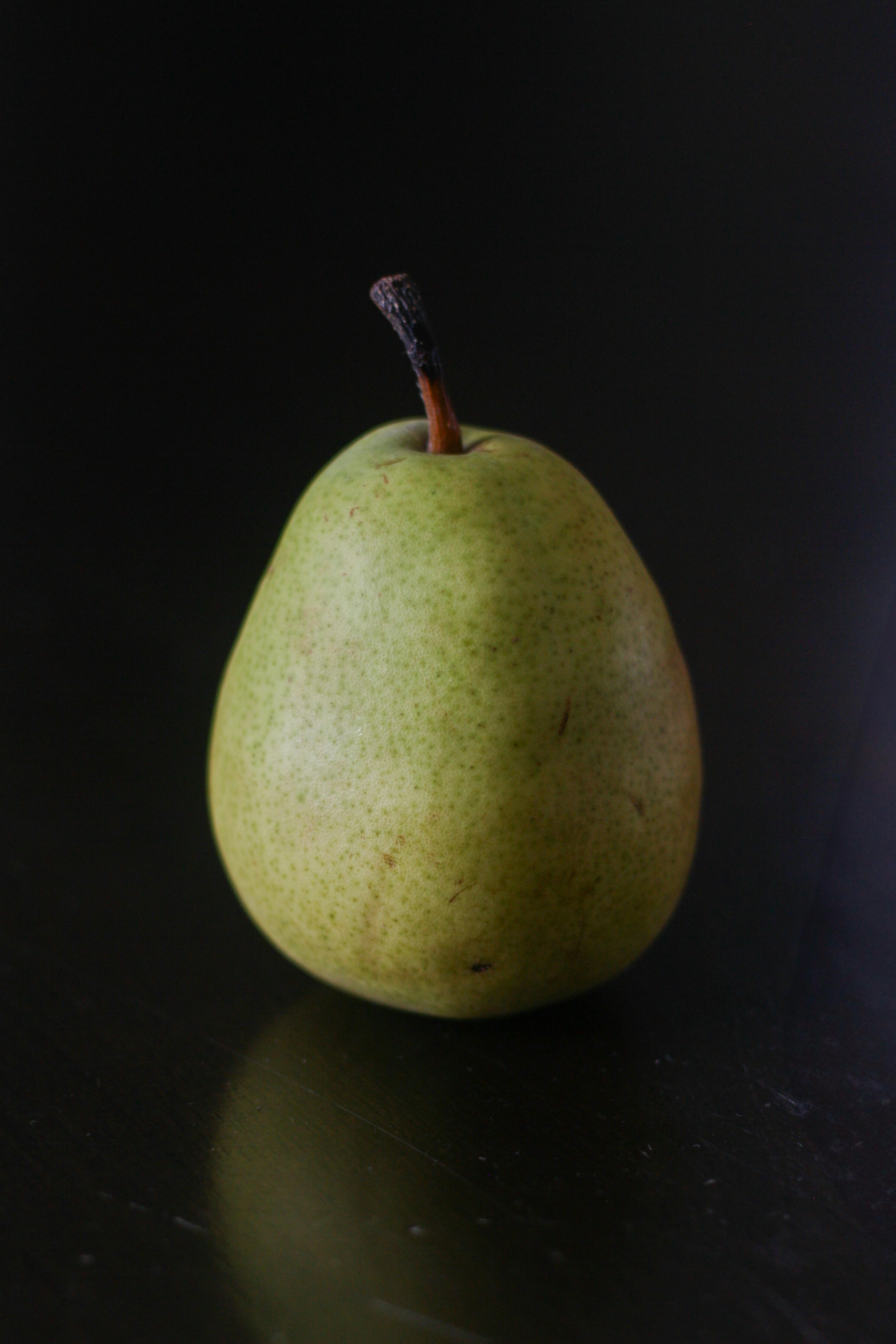 Minimalist Fine Art Photography of a Green Pear · Free Stock Photo