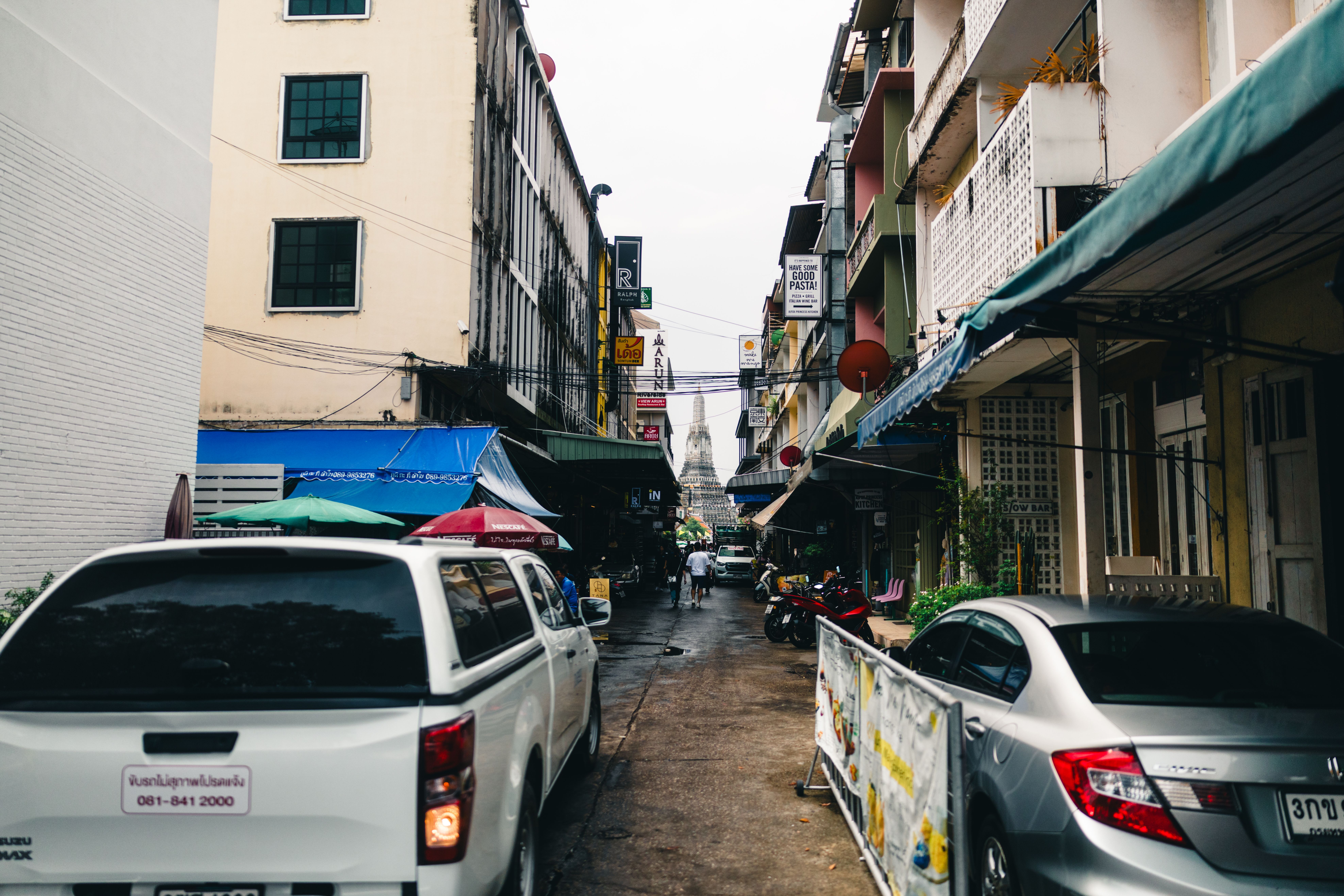 Street in Bangkok with Wat Arun in Background · Free Stock Photo