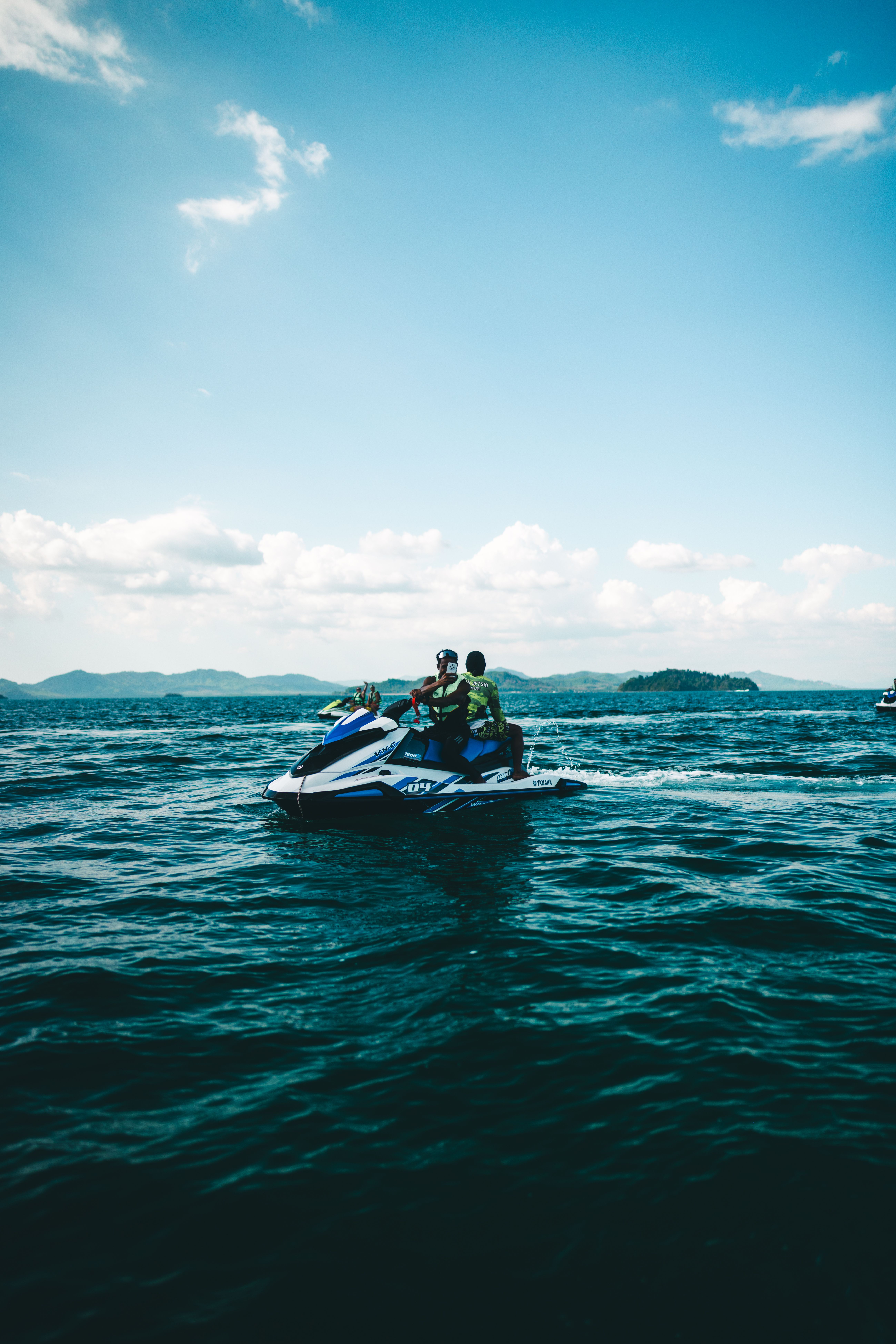 Empty Yellow and Black Jet Ski in Teal Sea Water · Free Stock Photo