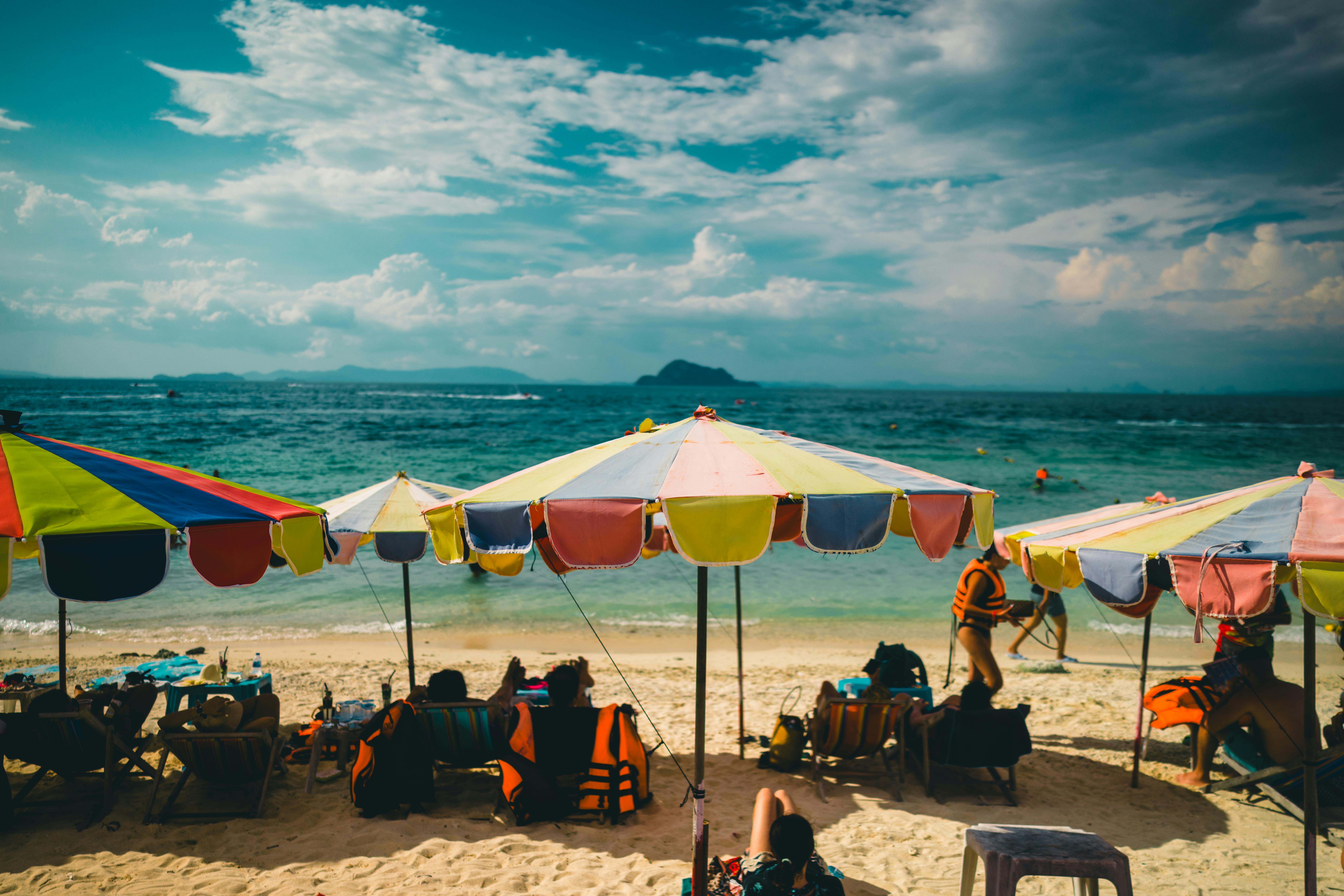 Colorful Beach Scene with Umbrellas in Phuket · Free Stock Photo