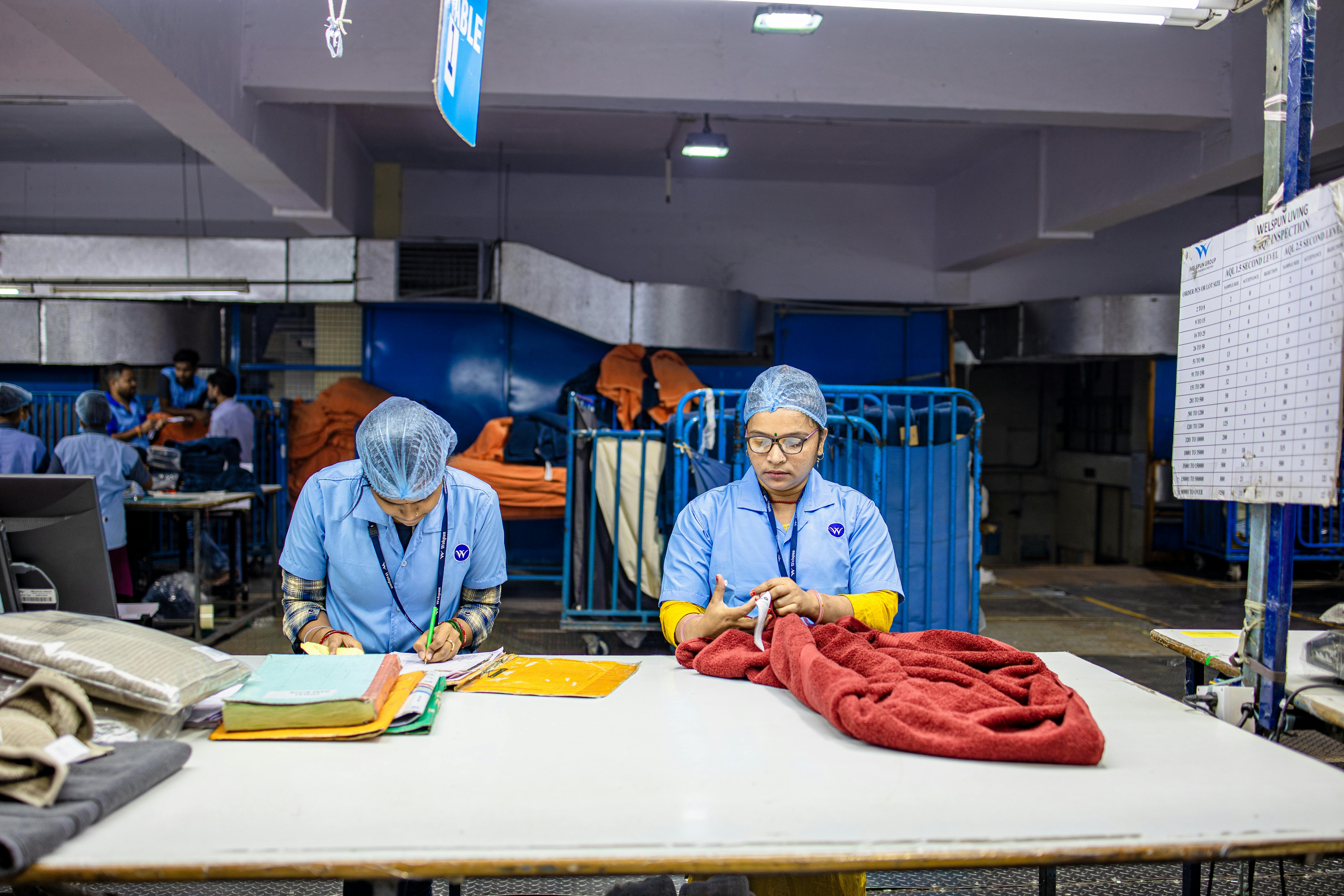 Textile Factory Workers Sorting Fabric · Free Stock Photo