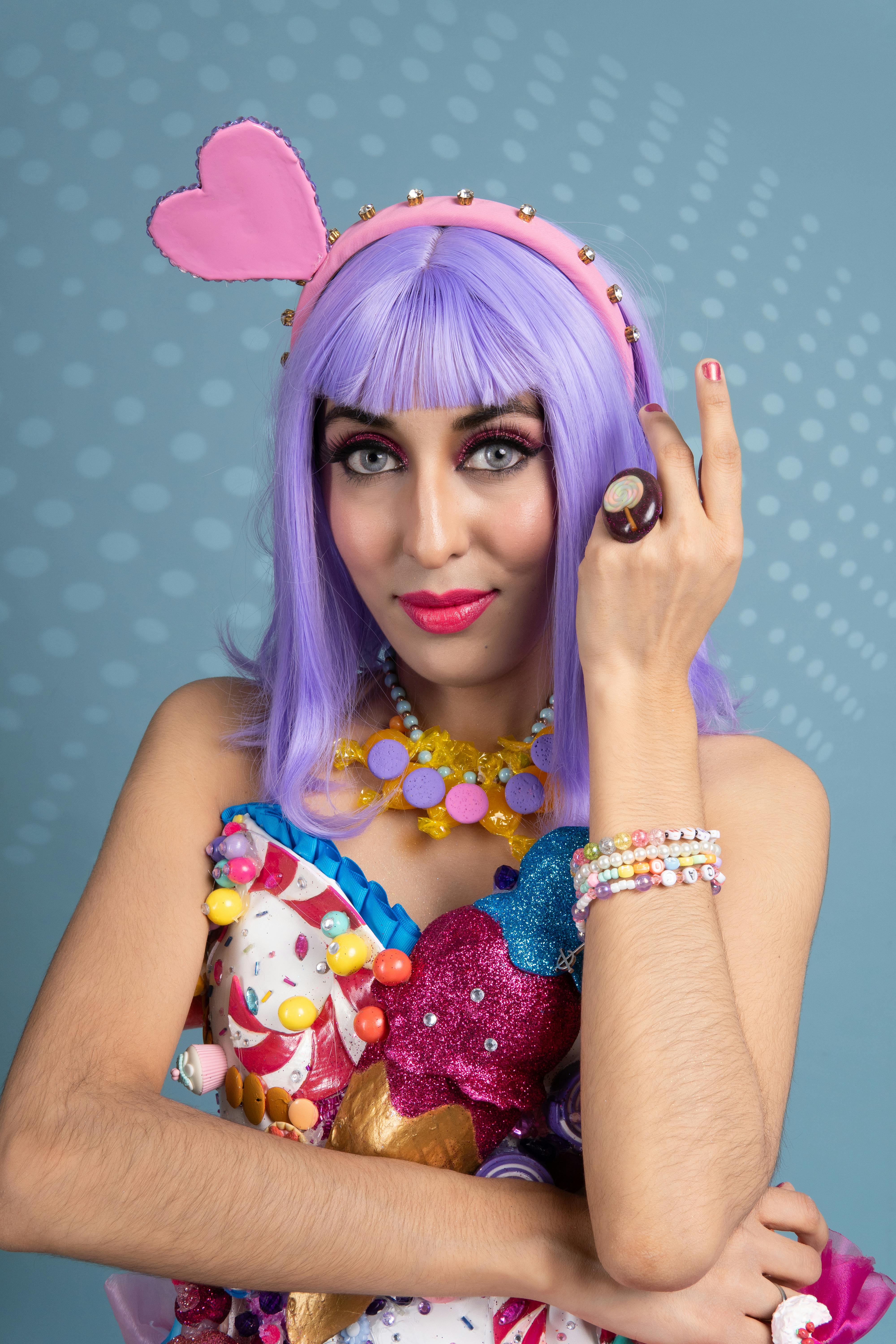 Colorful Cosplay with Purple Wig and Vibrant Attire · Free Stock Photo