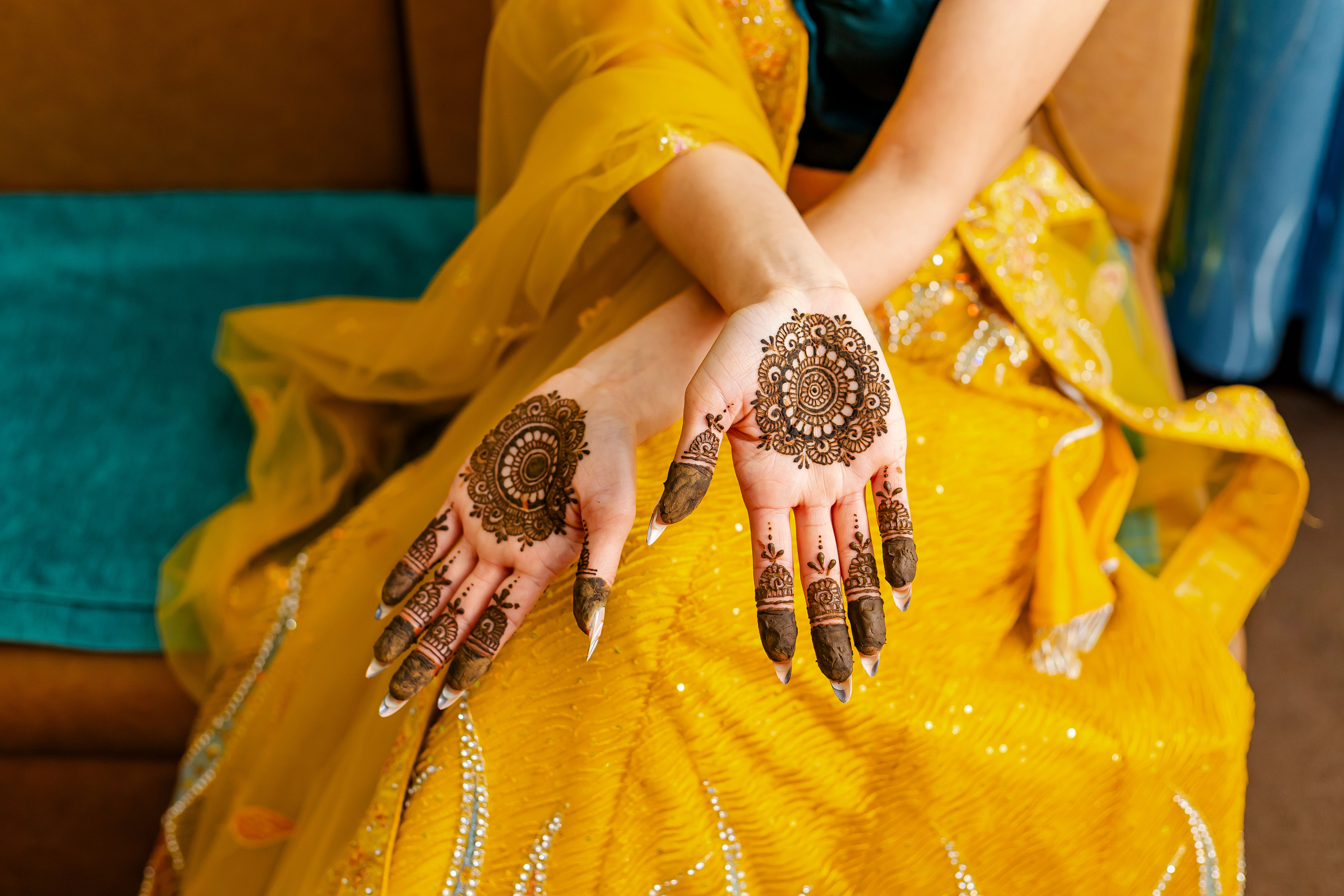 Traditional Mehndi Design on Hands with Yellow Saree · Free Stock Photo