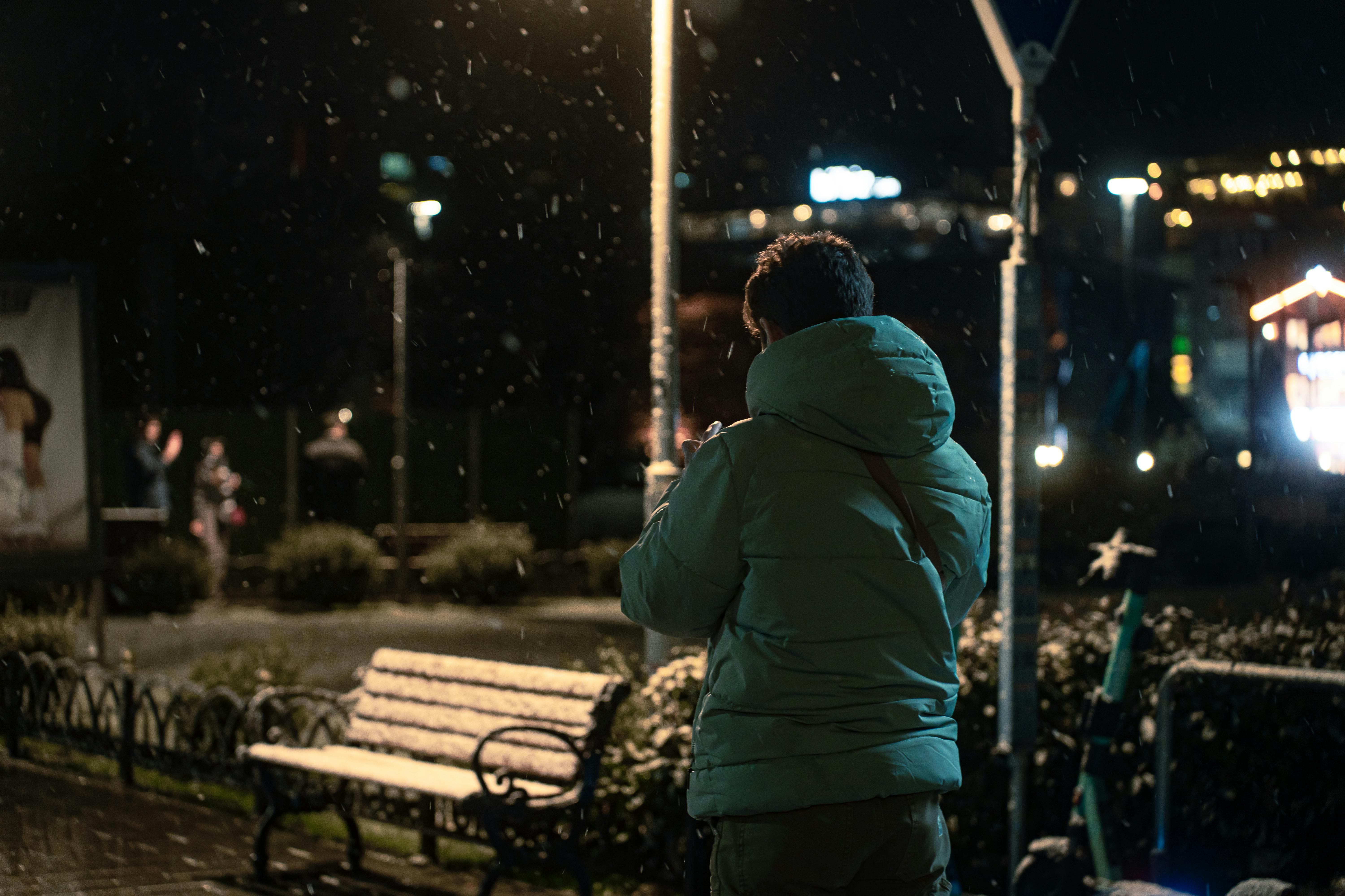 Nighttime Snowfall in Urban Park Setting · Free Stock Photo