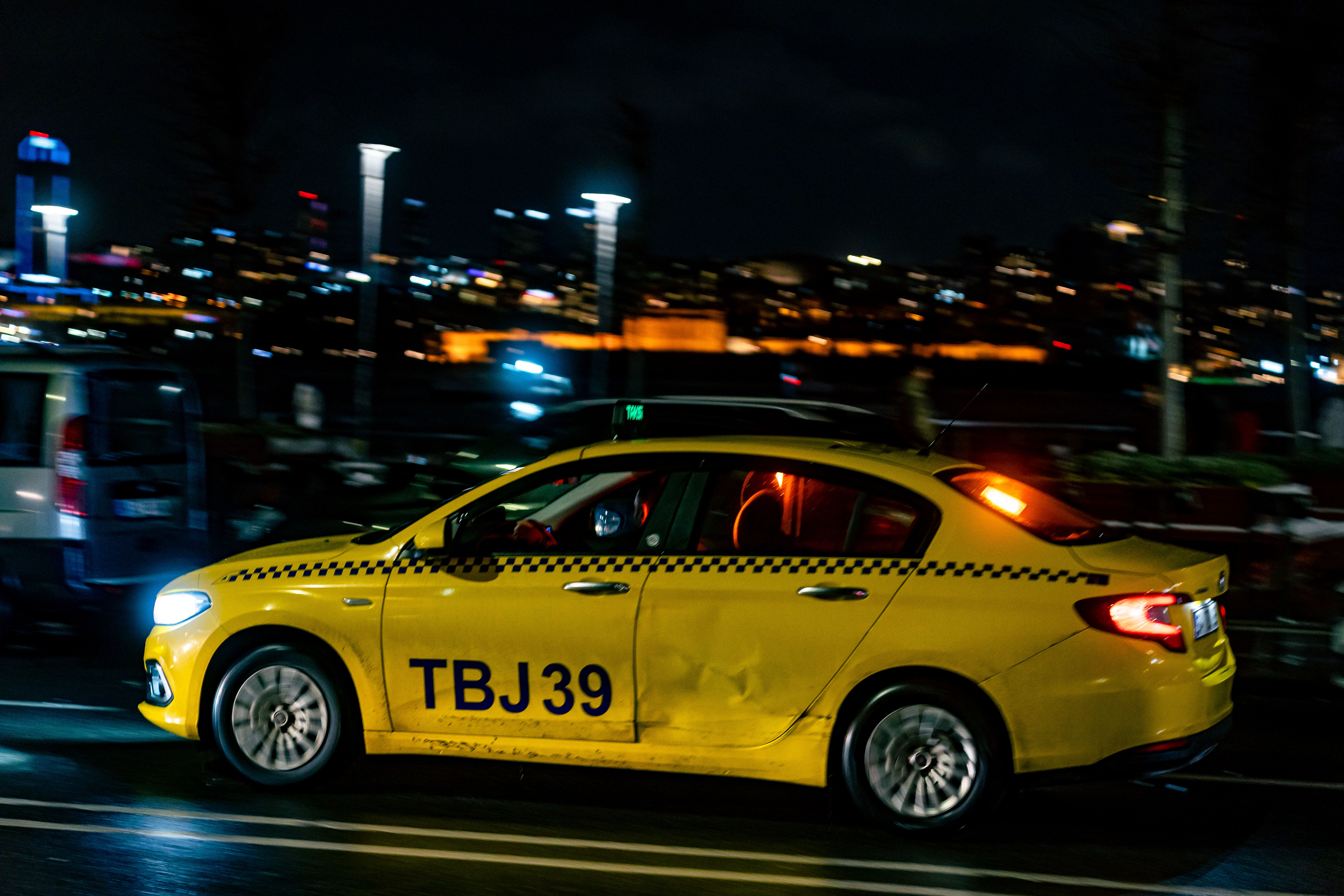 Night City Shot of Yellow Taxi in Motion · Free Stock Photo