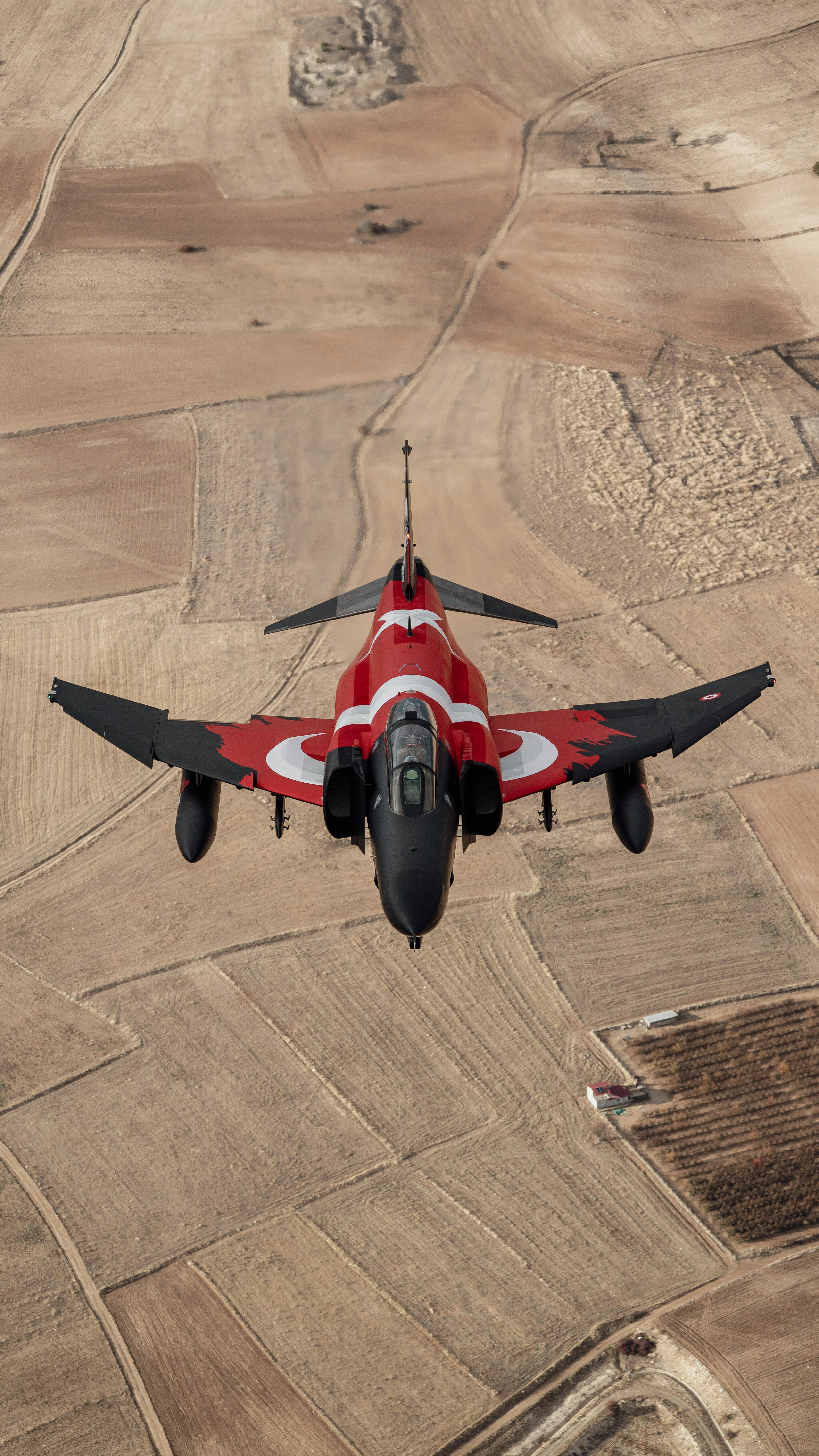 Aerial View of Military Jet Over Farmland · Free Stock Photo