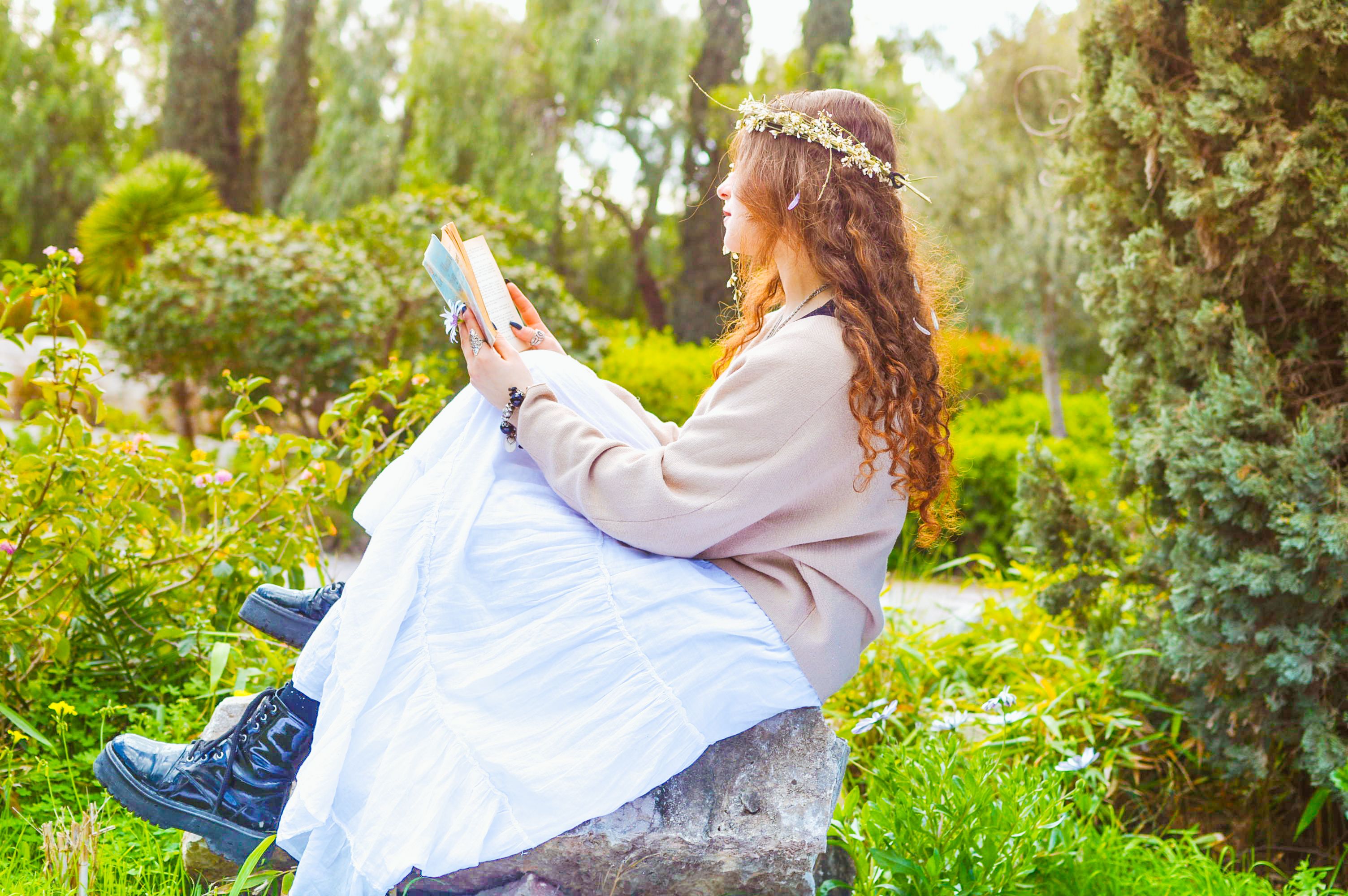 Woman Relaxing with Book in Sunny Garden · Free Stock Photo