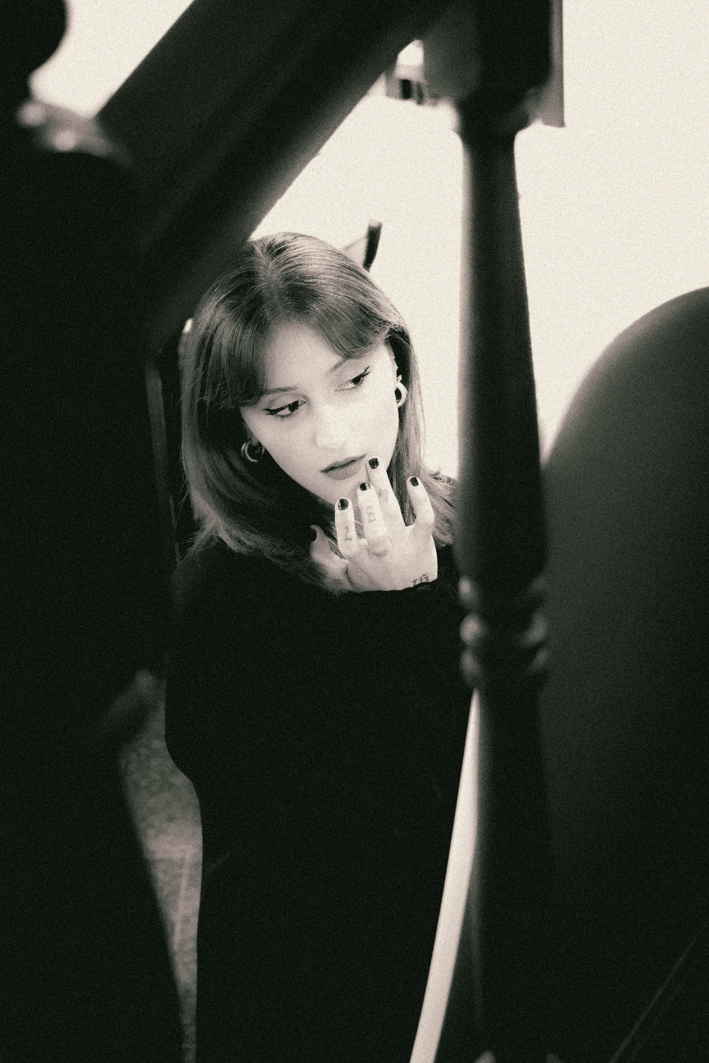 Introspective Woman by a Mirror Reflection · Free Stock Photo