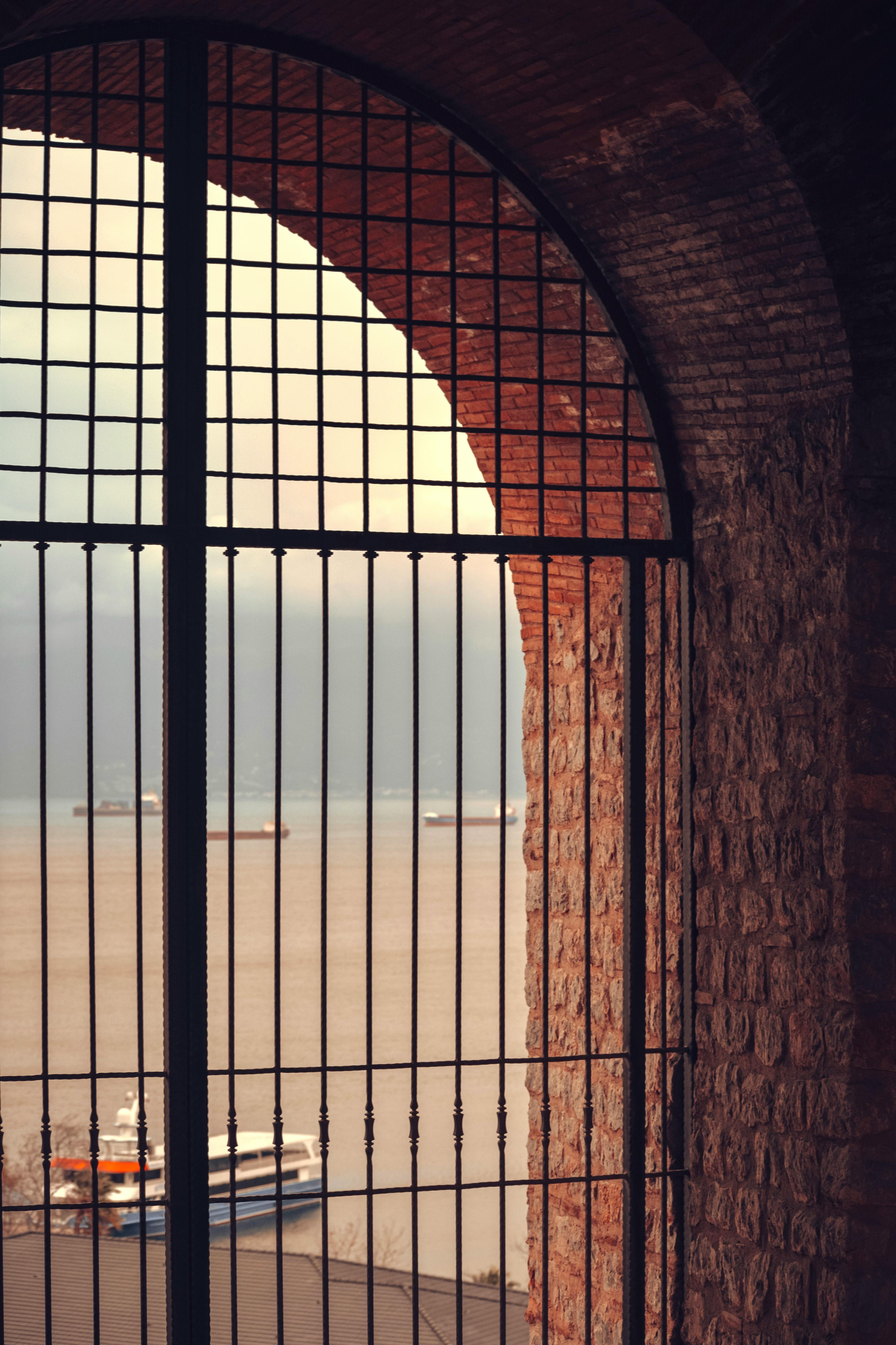 Scenic Waterfront View Through Arched Window in Kocaeli · Free Stock Photo