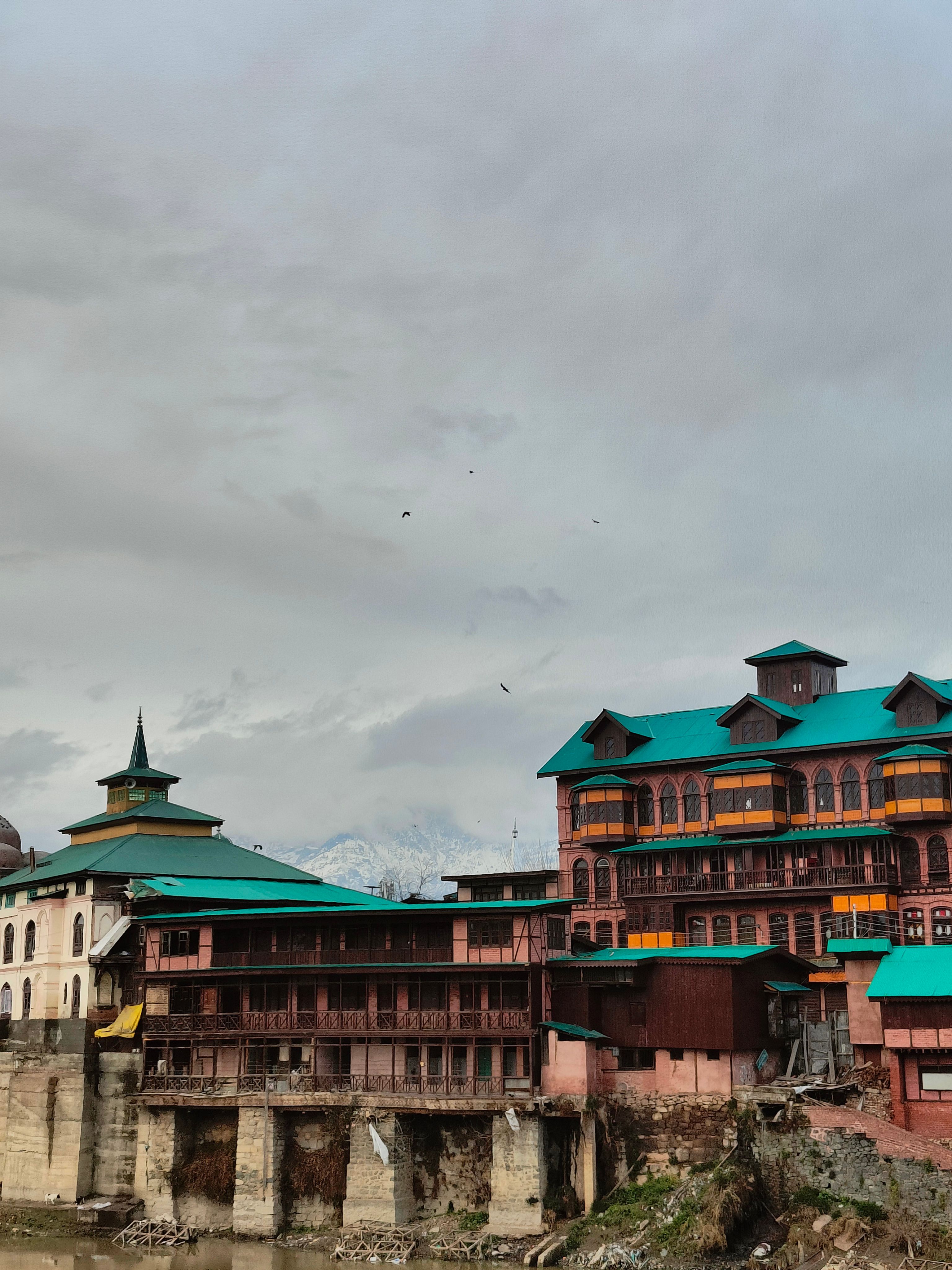 Historic Buildings with Mountain View Skyline · Free Stock Photo