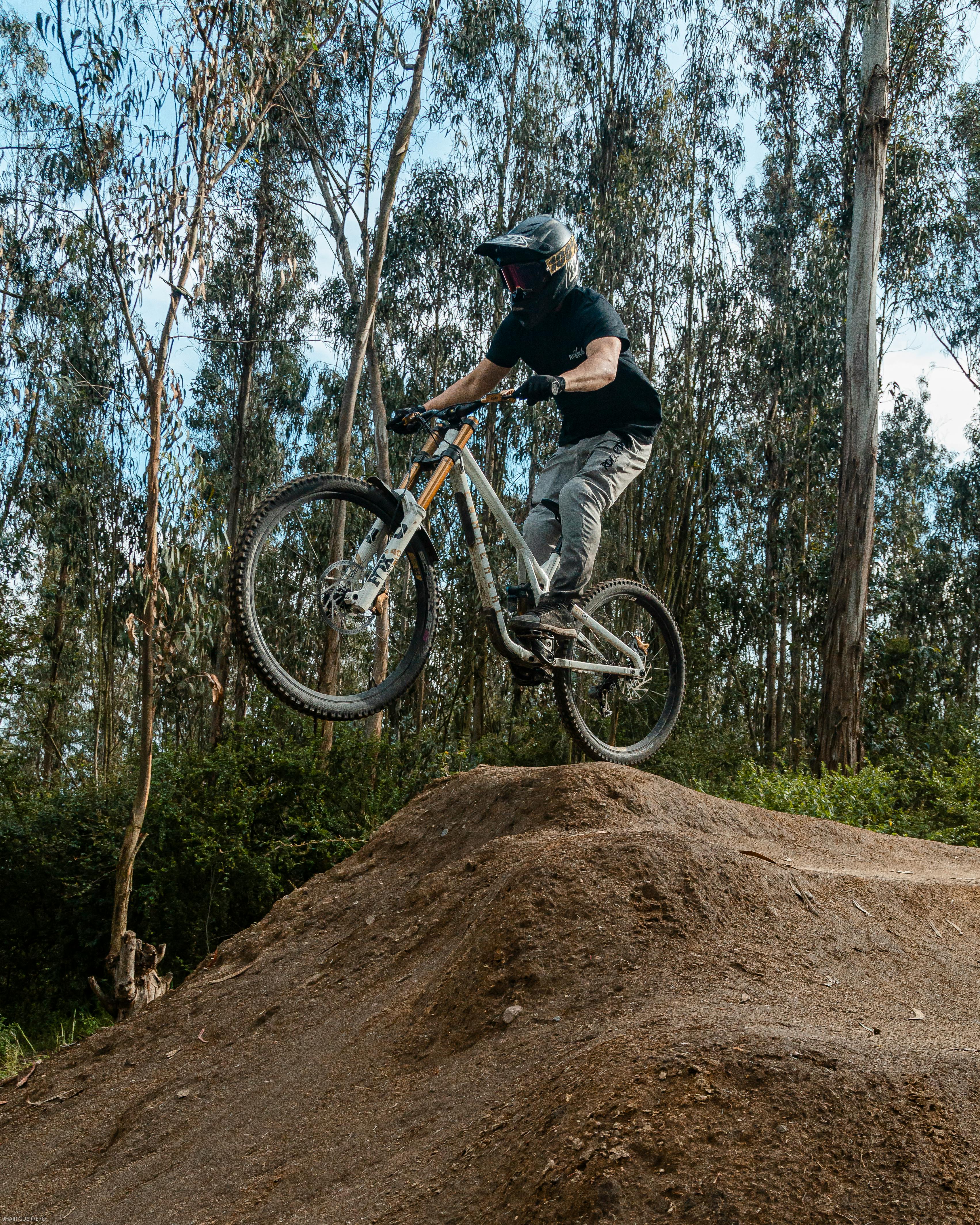 Thrilling Mountain Bike Jump in Quito Forest · Free Stock Photo