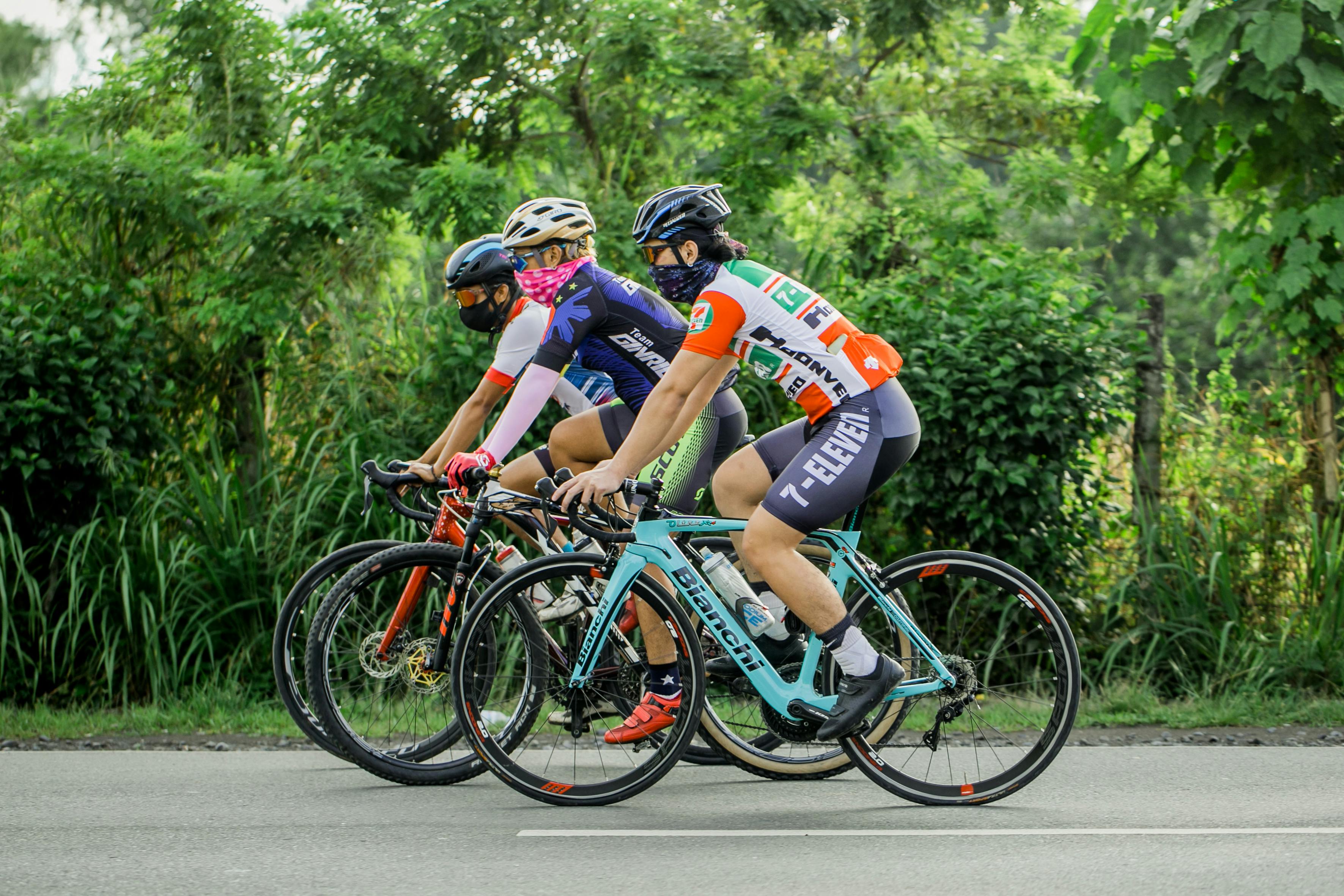 Cyclists Riding in Davao City Outdoors · Free Stock Photo