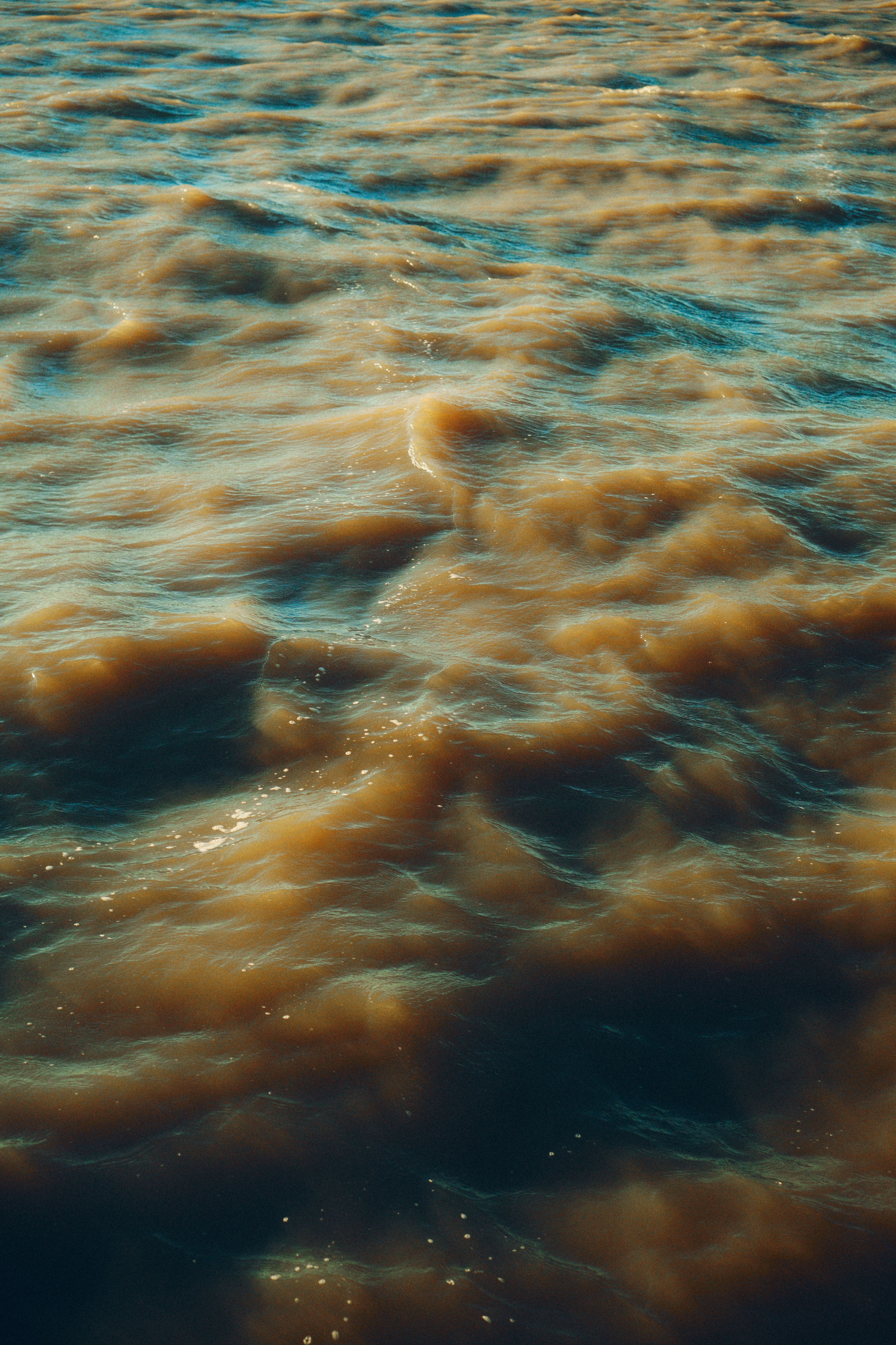 Golden Hour Waves on Tranquil Water Surface · Free Stock Photo