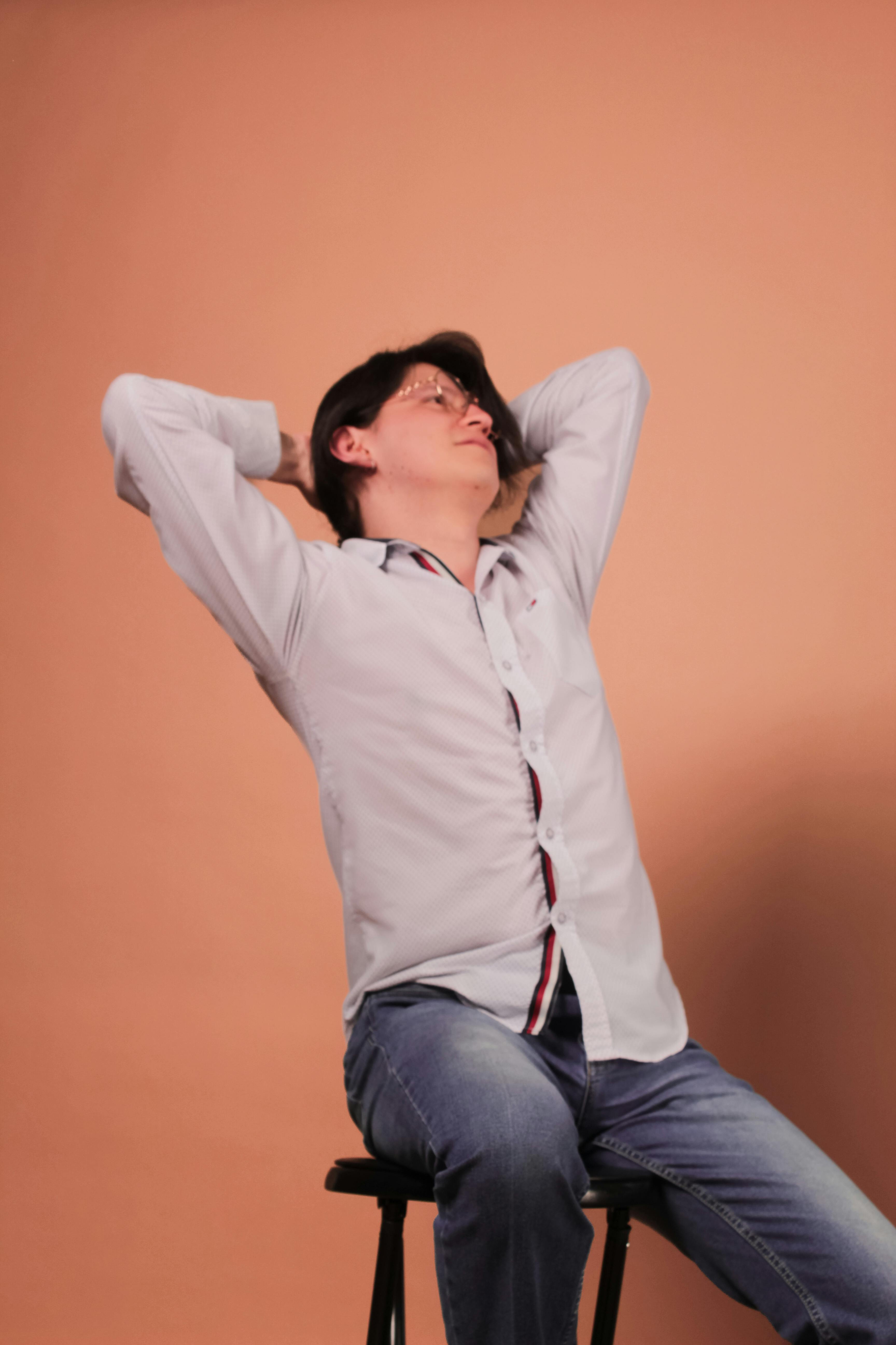 Relaxed Male Model Posing in Studio Setting · Free Stock Photo