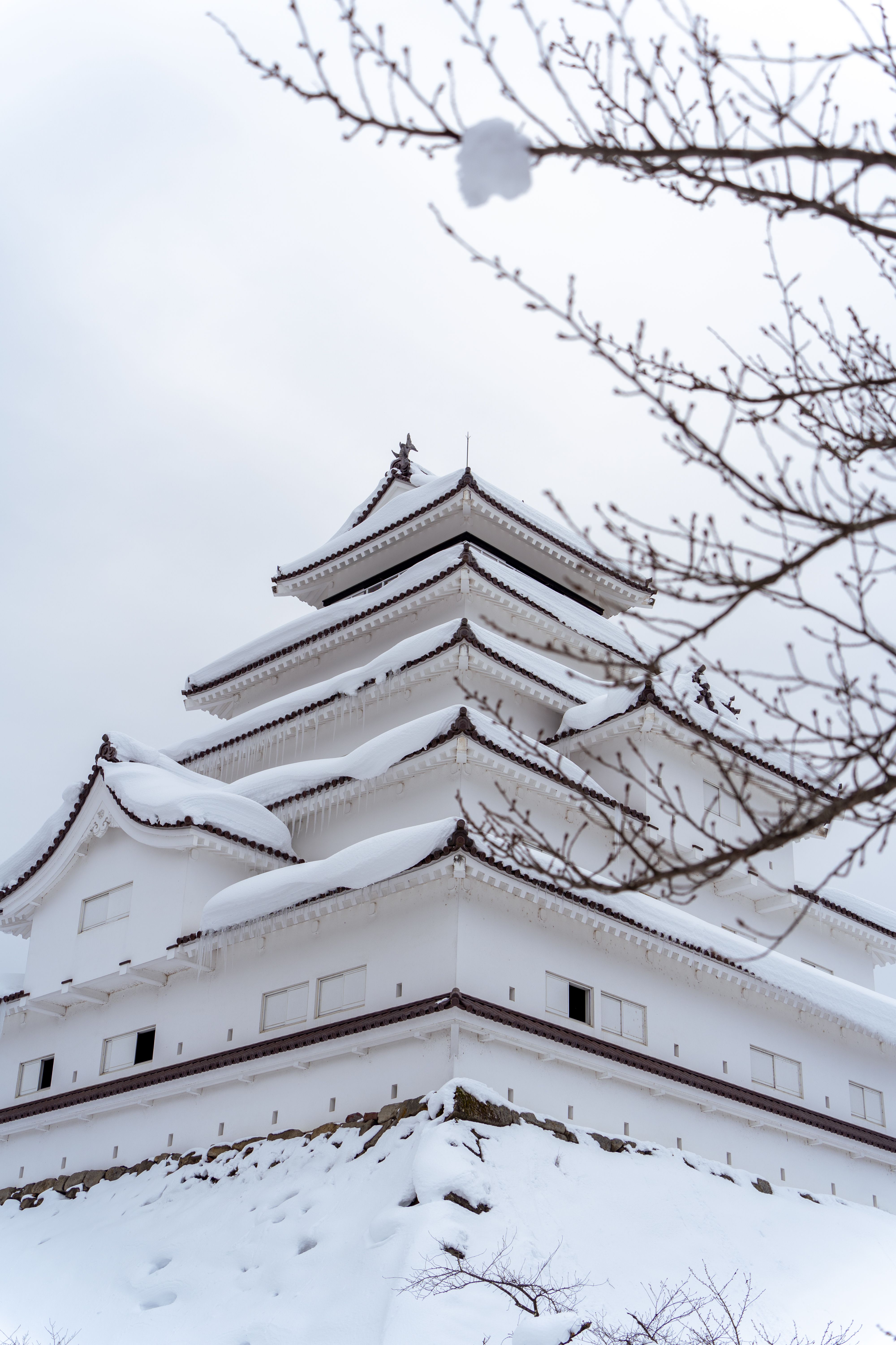 Snow-Covered Traditional Japanese Castle · Free Stock Photo