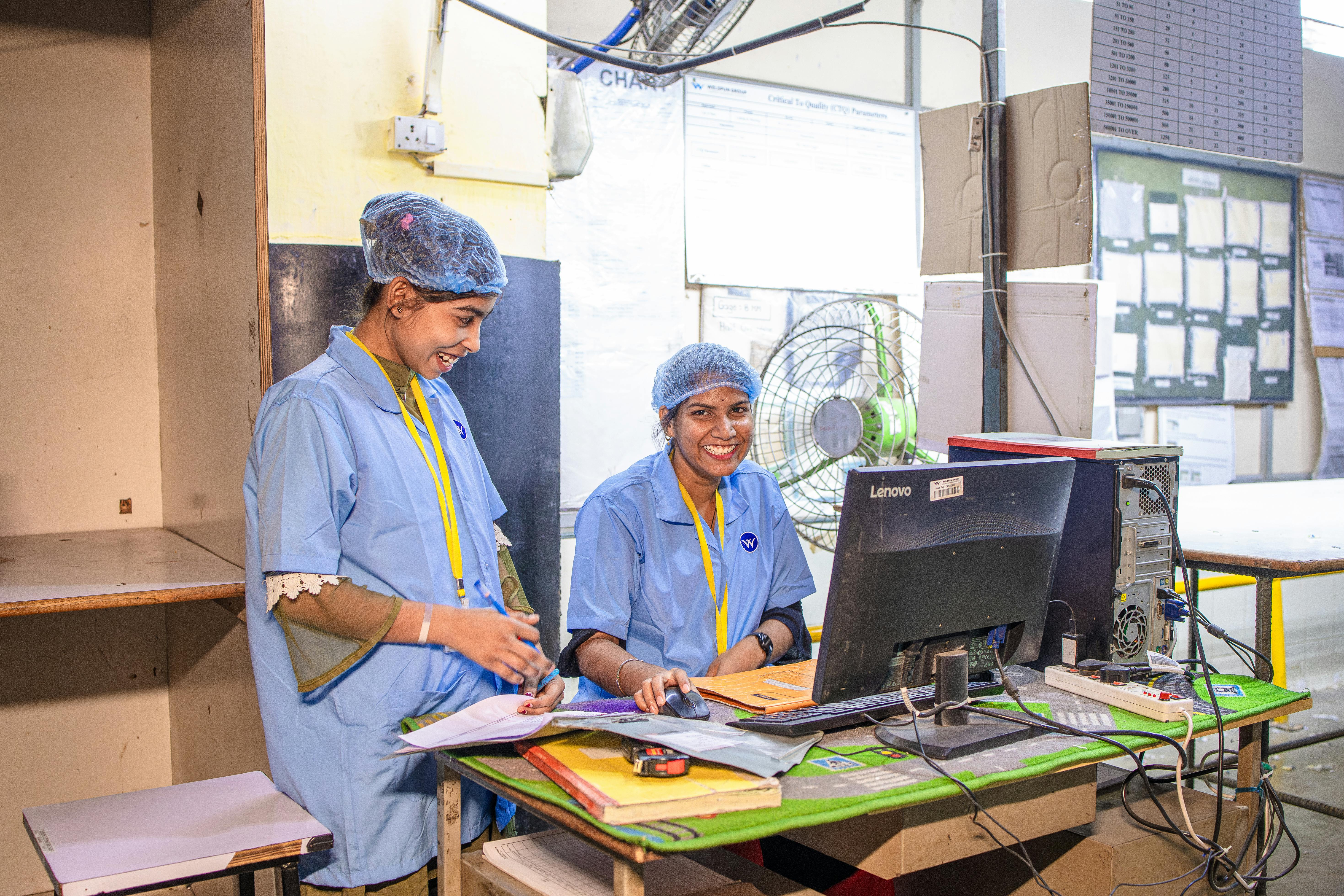Smiling Factory Workers at Textile Station · Free Stock Photo