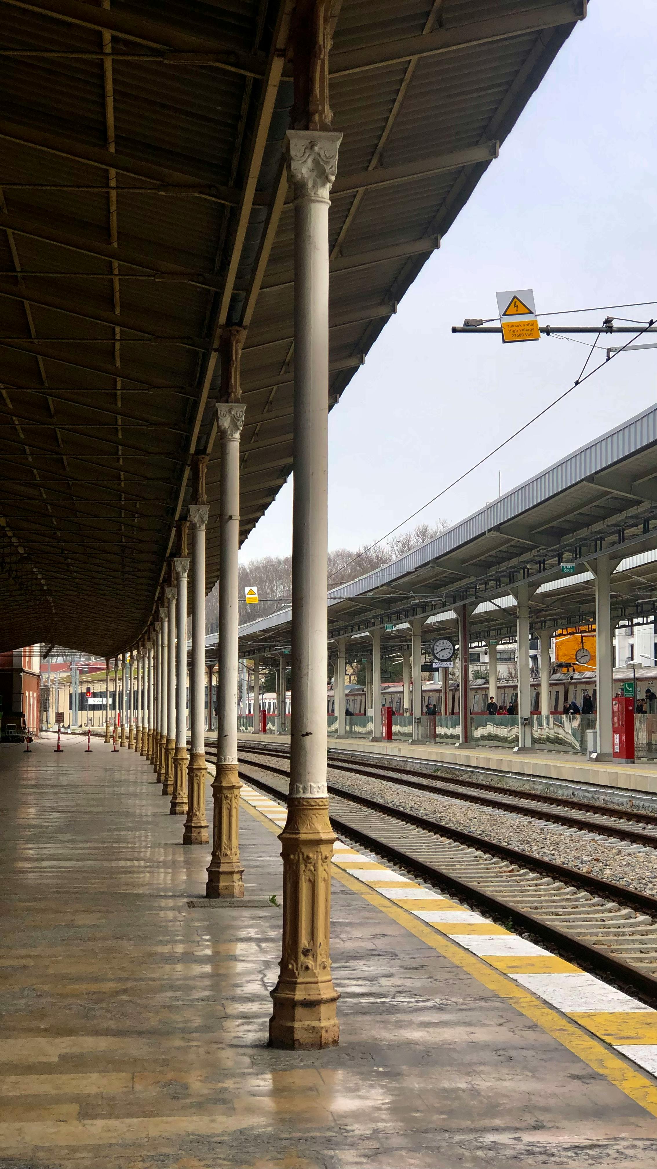 Empty Train Station Platform on Overcast Day · Free Stock Photo