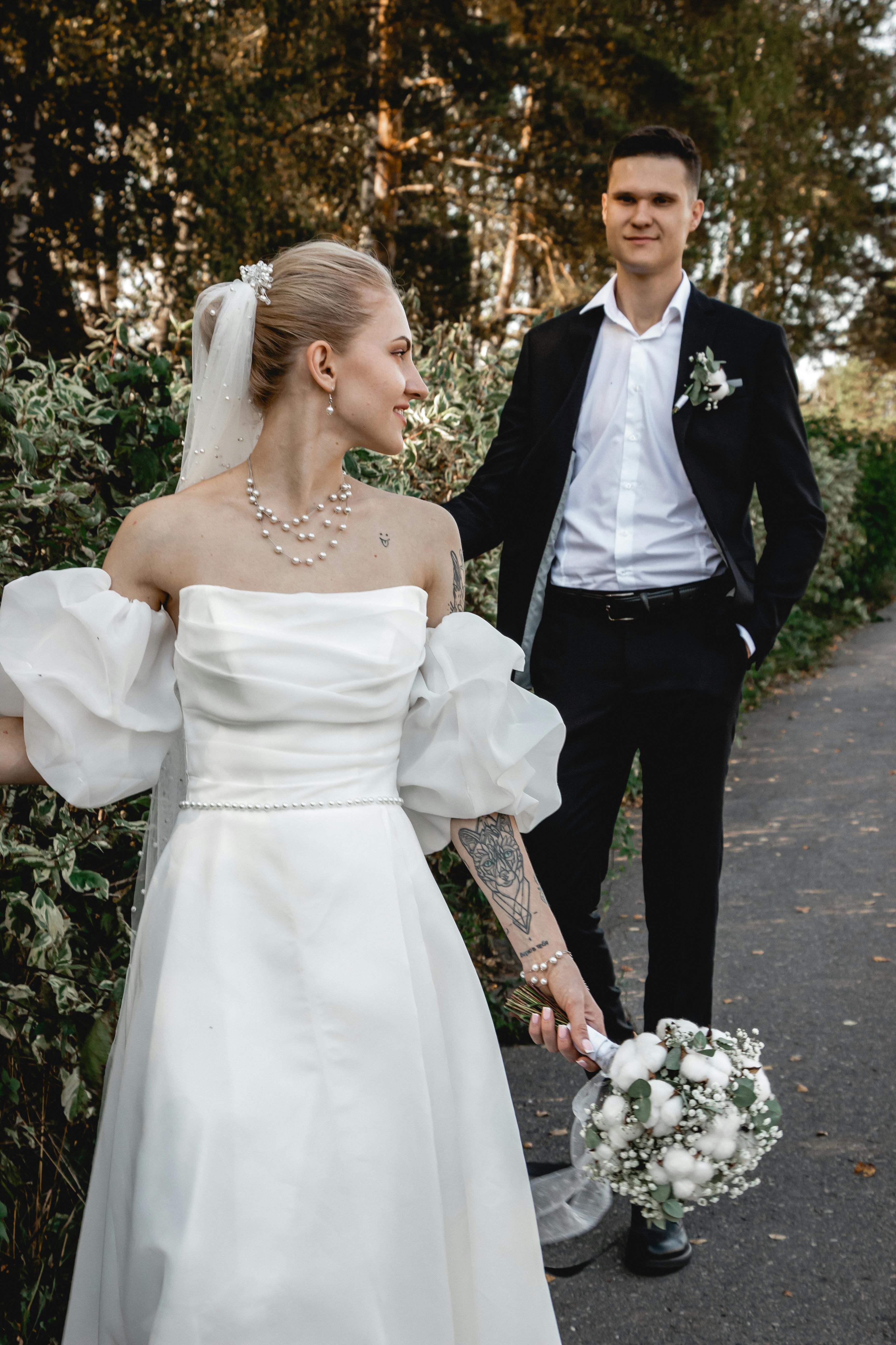 Elegant Outdoor Wedding Scene with Bride and Groom · Free Stock Photo