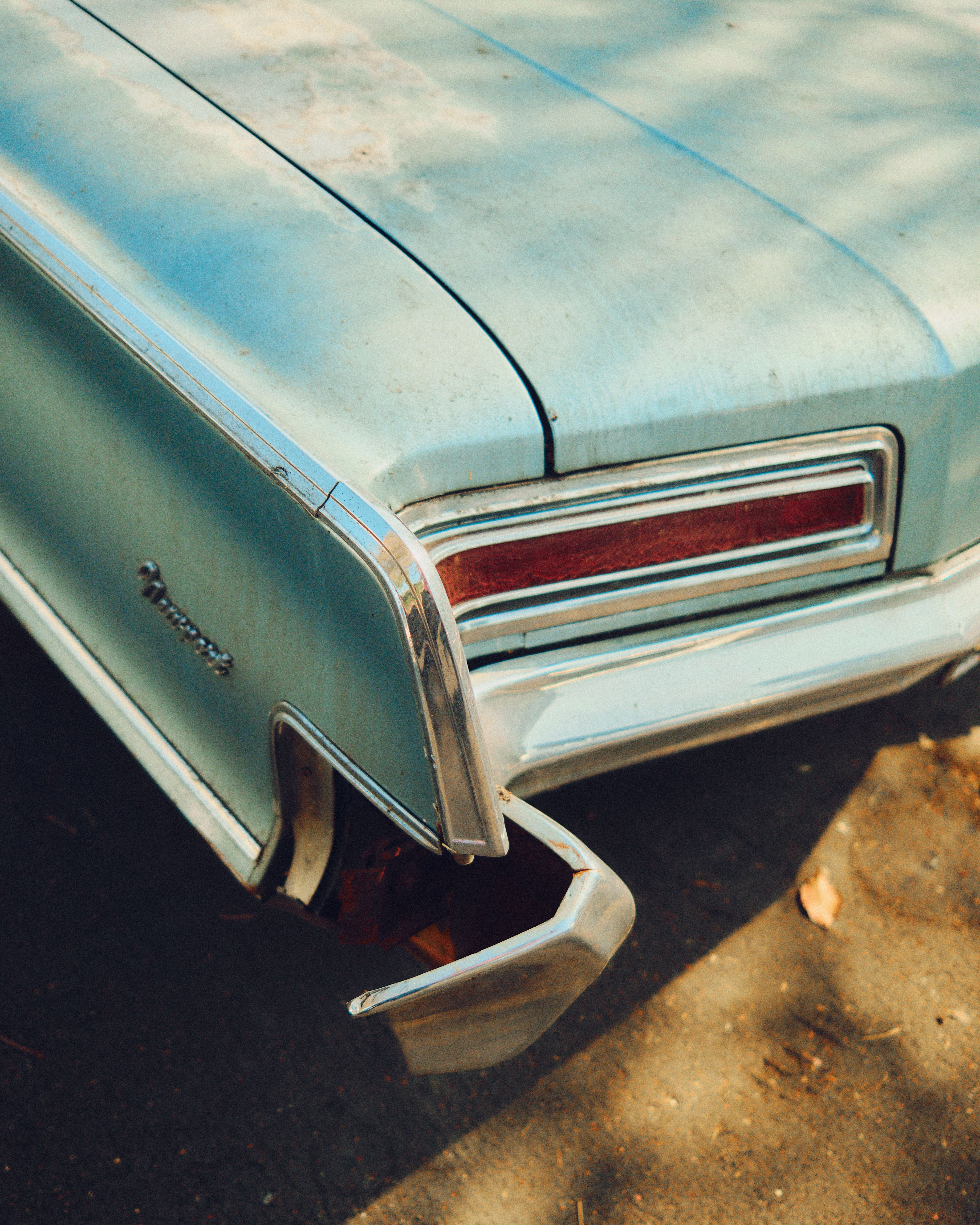 Vintage Blue Car with Chrome Tail Fin Detail · Free Stock Photo
