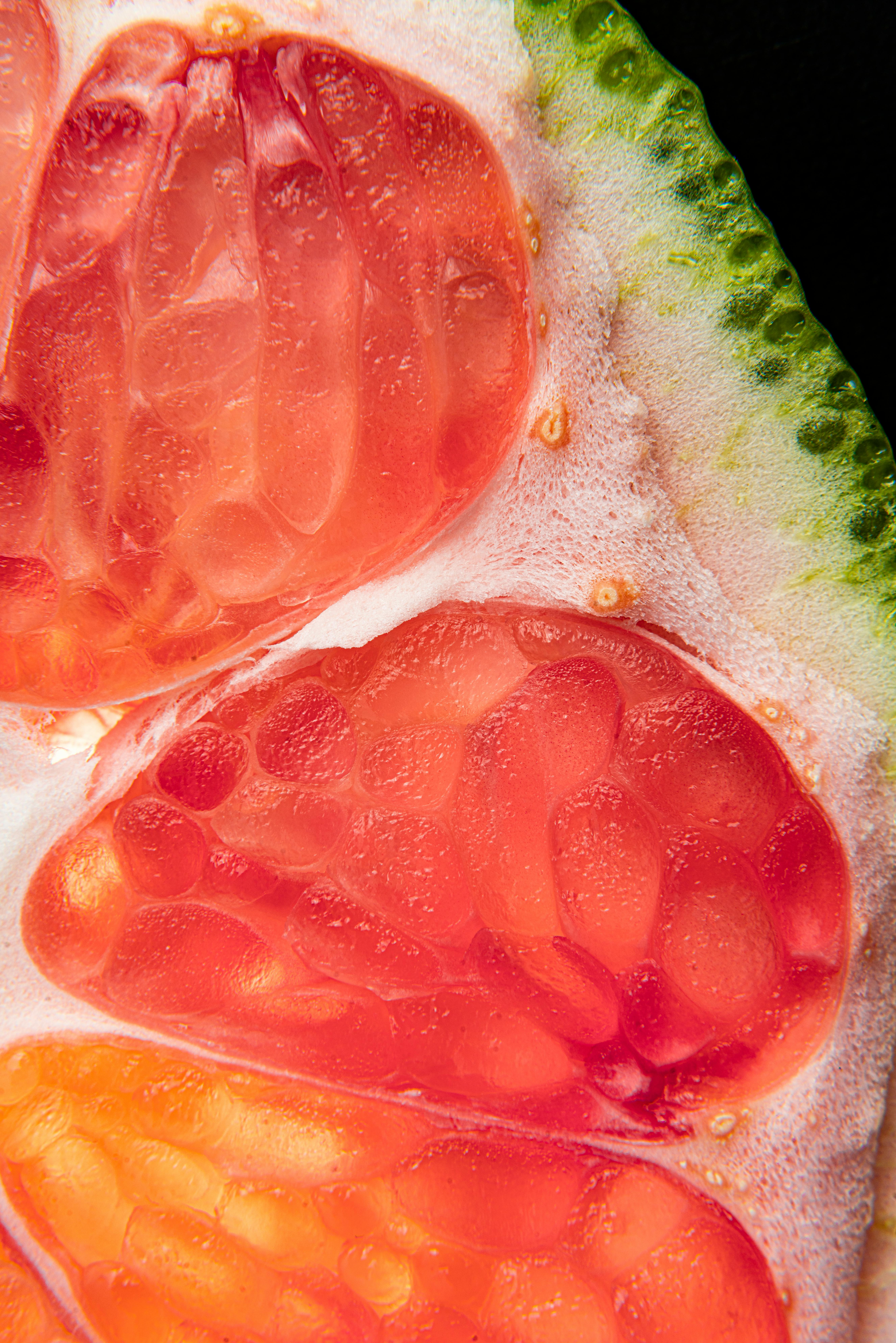 Close-Up Shot of Grapefruit Segments · Free Stock Photo