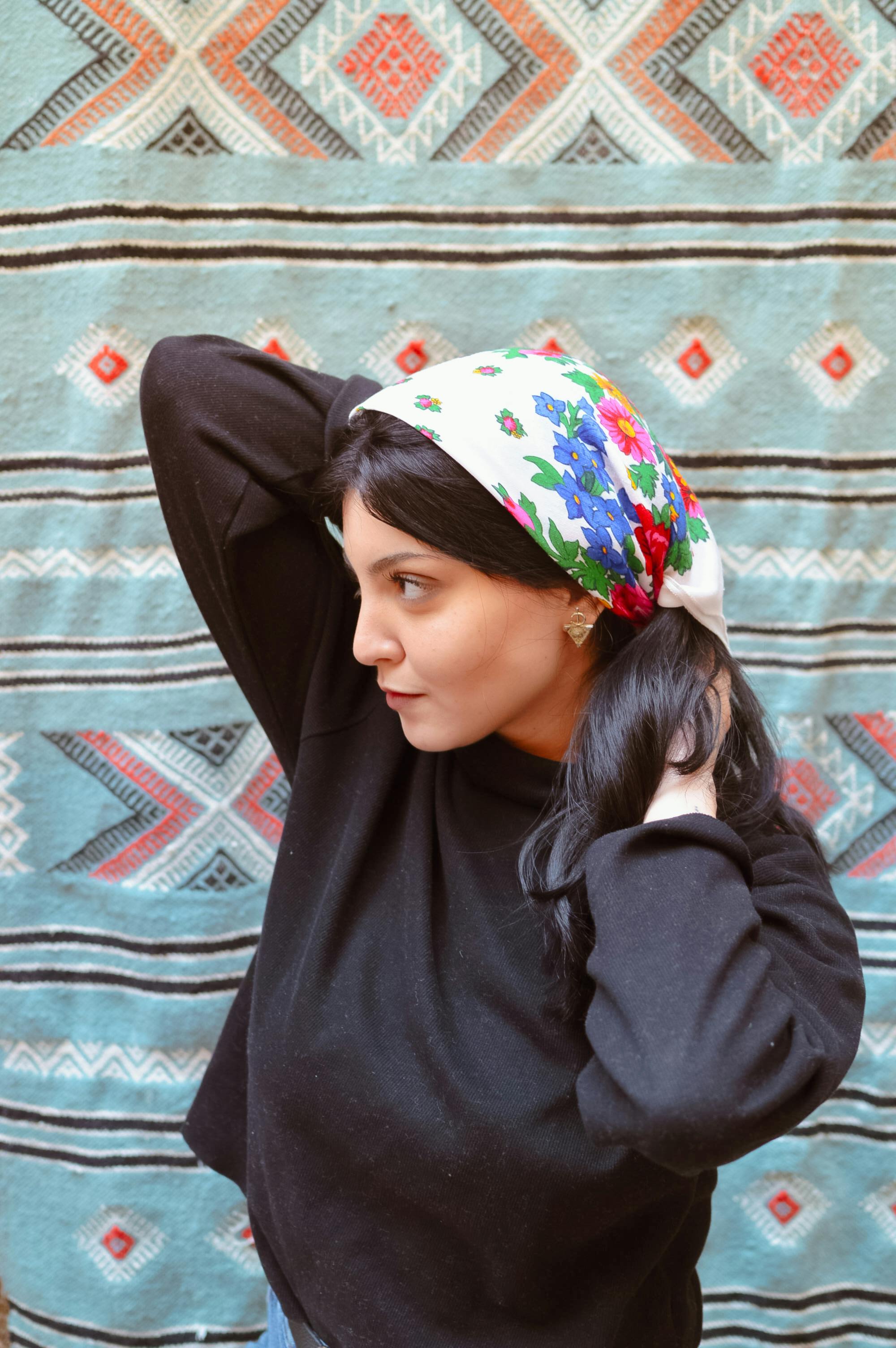 Young Woman with Colorful Headscarf in front of Rug · Free Stock Photo