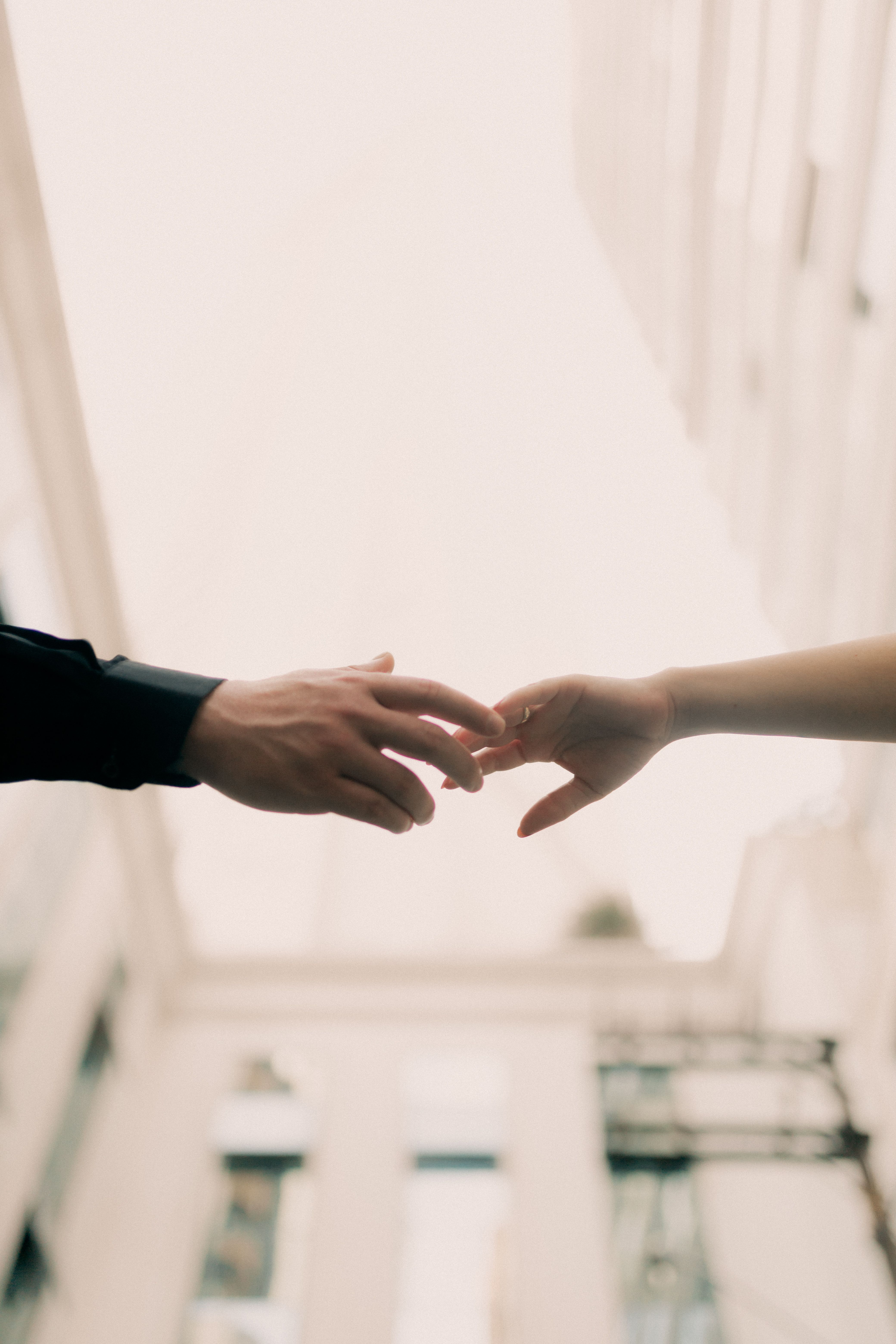 Romantic Moment of Hands Touching Outdoors · Free Stock Photo