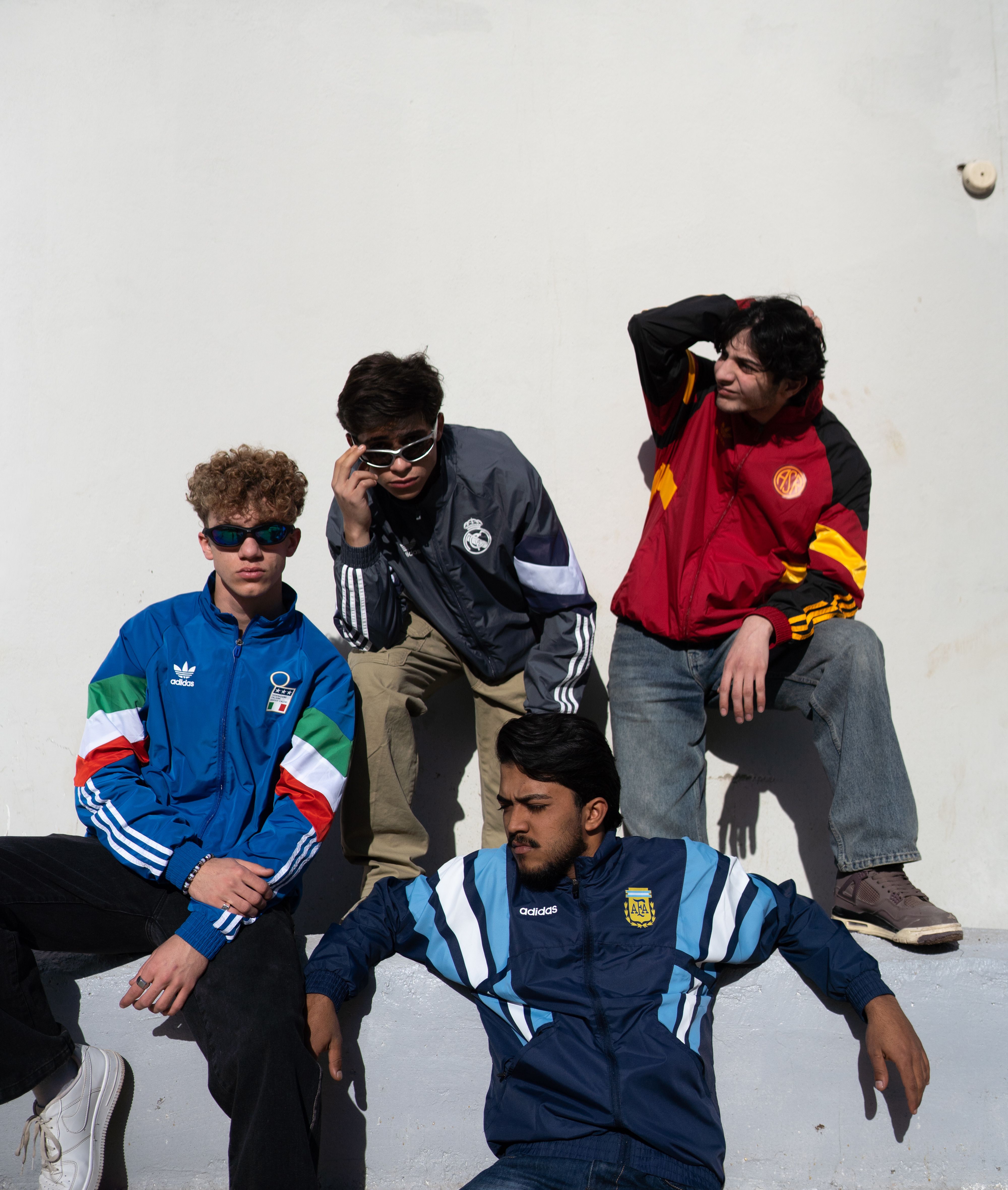 Group of Young Men in Fashionable Jackets Outdoors · Free Stock Photo