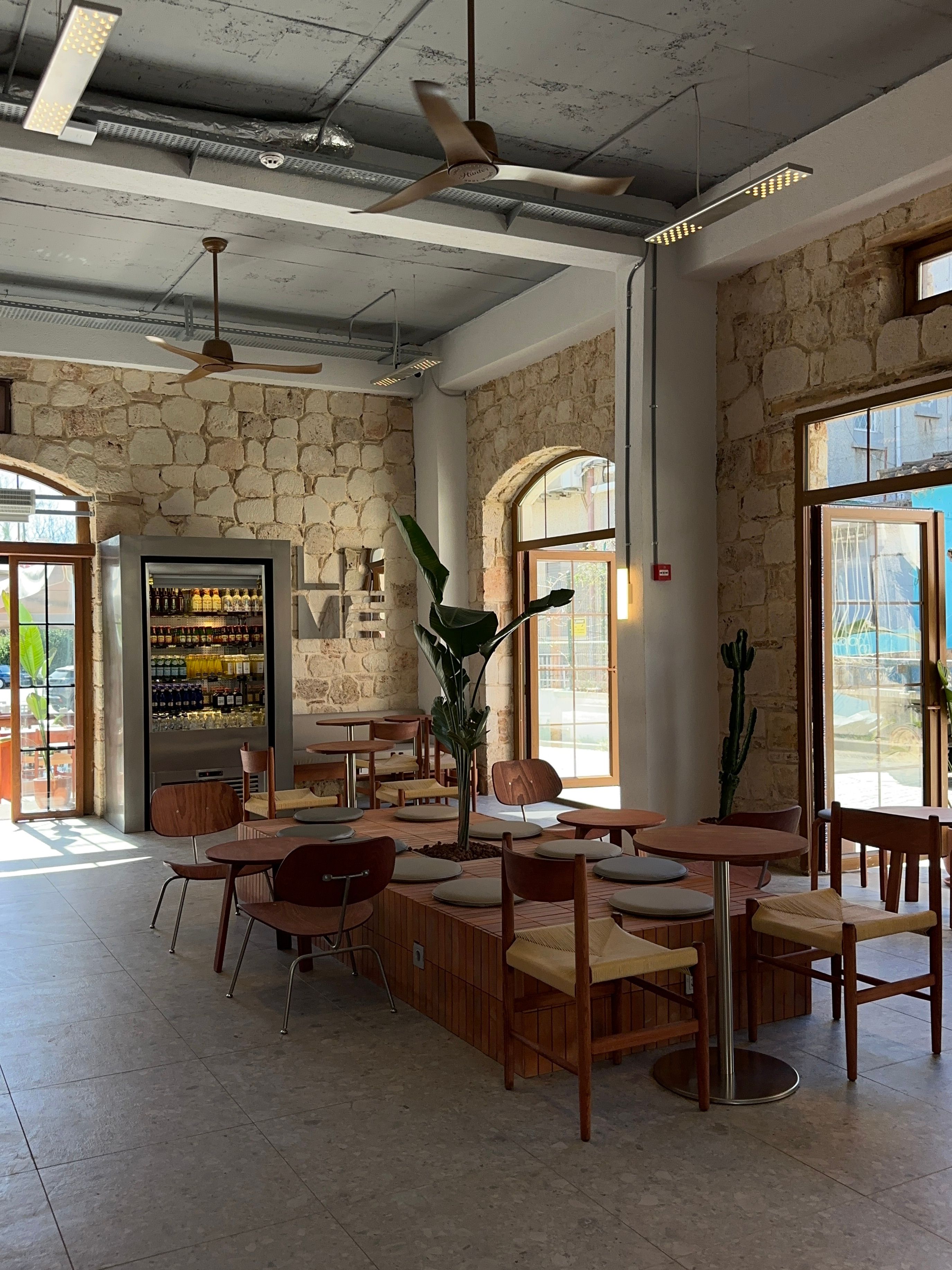 Cozy Modern Cafe Interior with Rustic Decor · Free Stock Photo