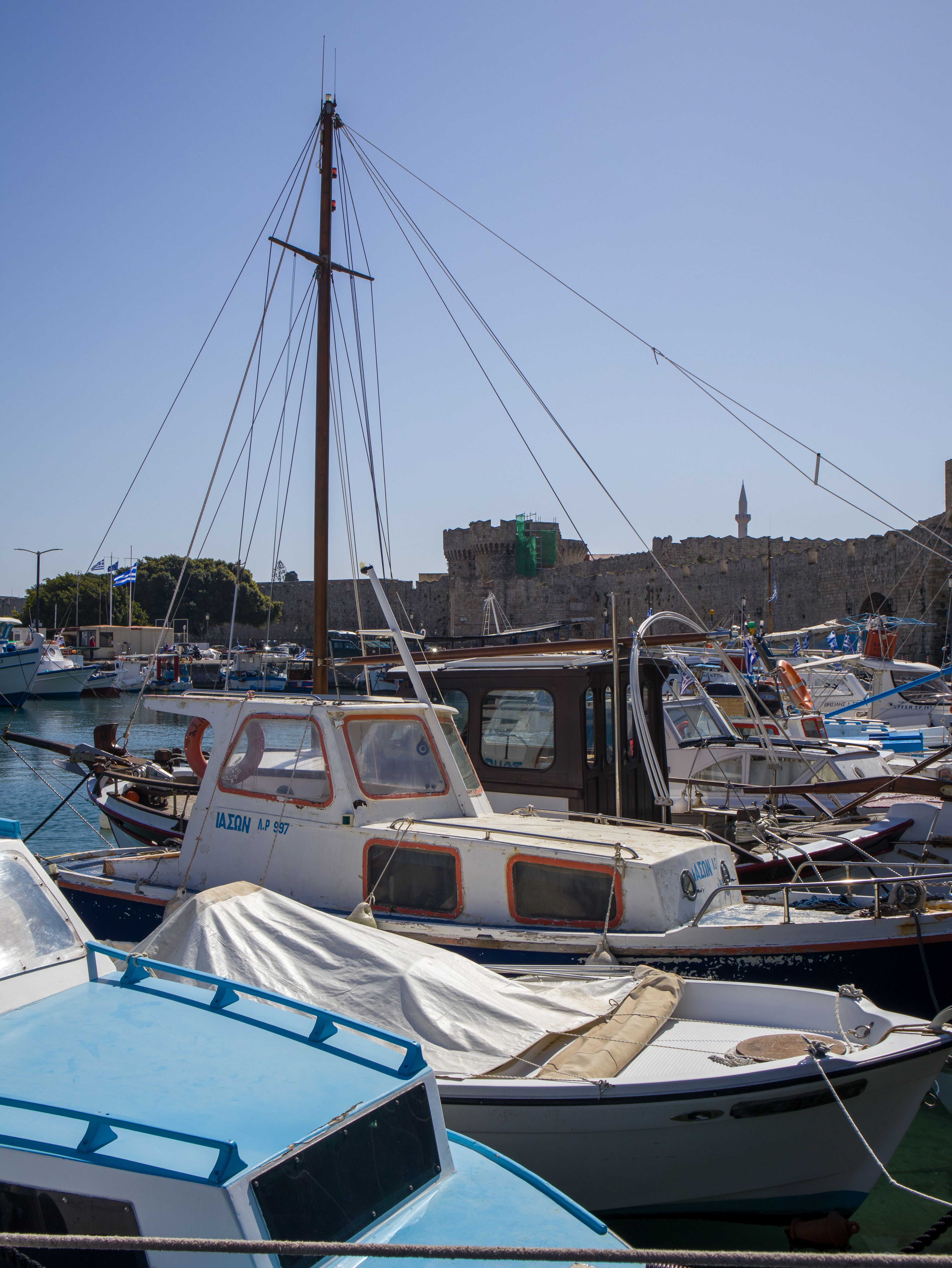 Calm Harbor Scene with Sailboats and Historic Fortress · Free Stock Photo