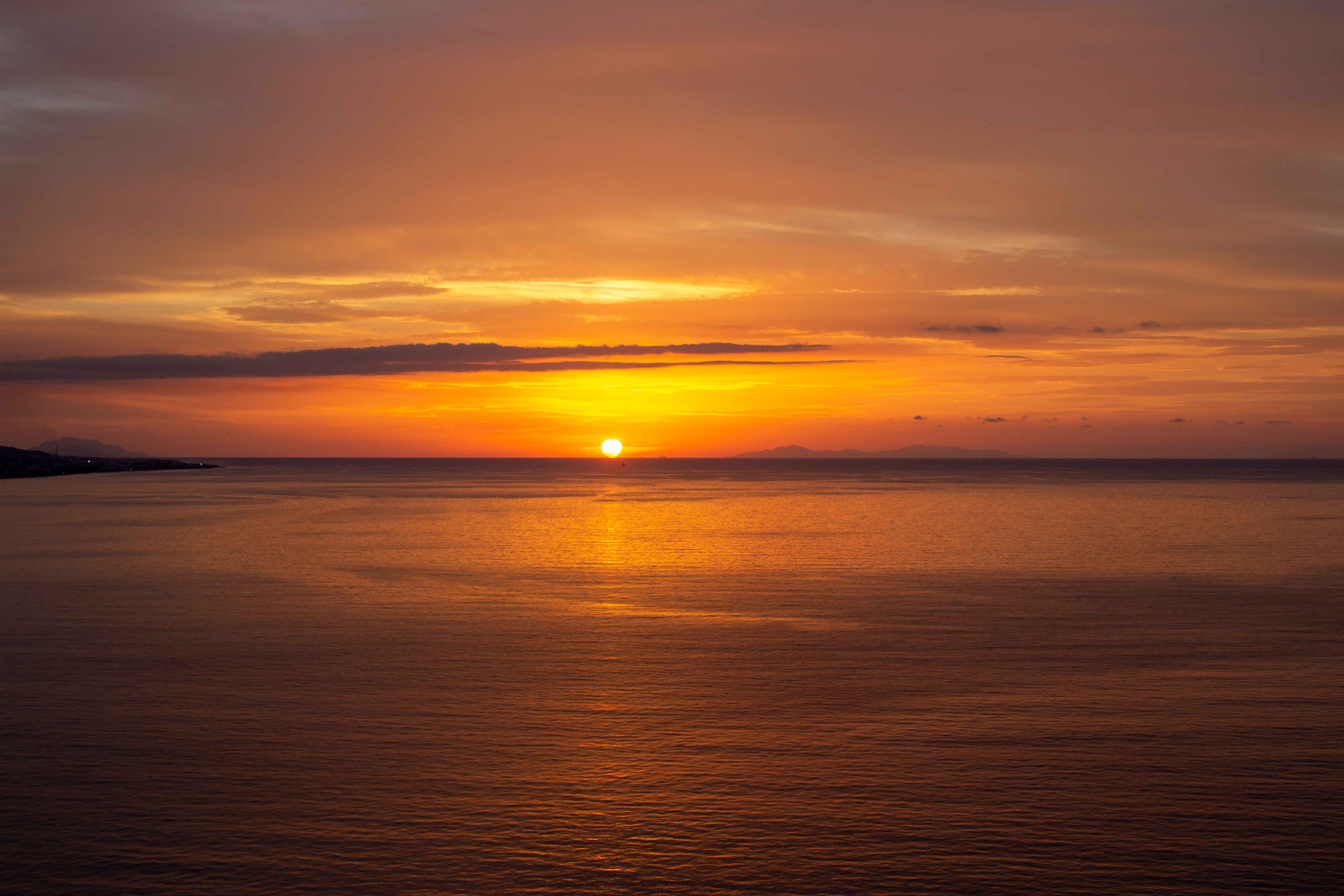 Stunning Orange Sunset Over Calm Ocean · Free Stock Photo