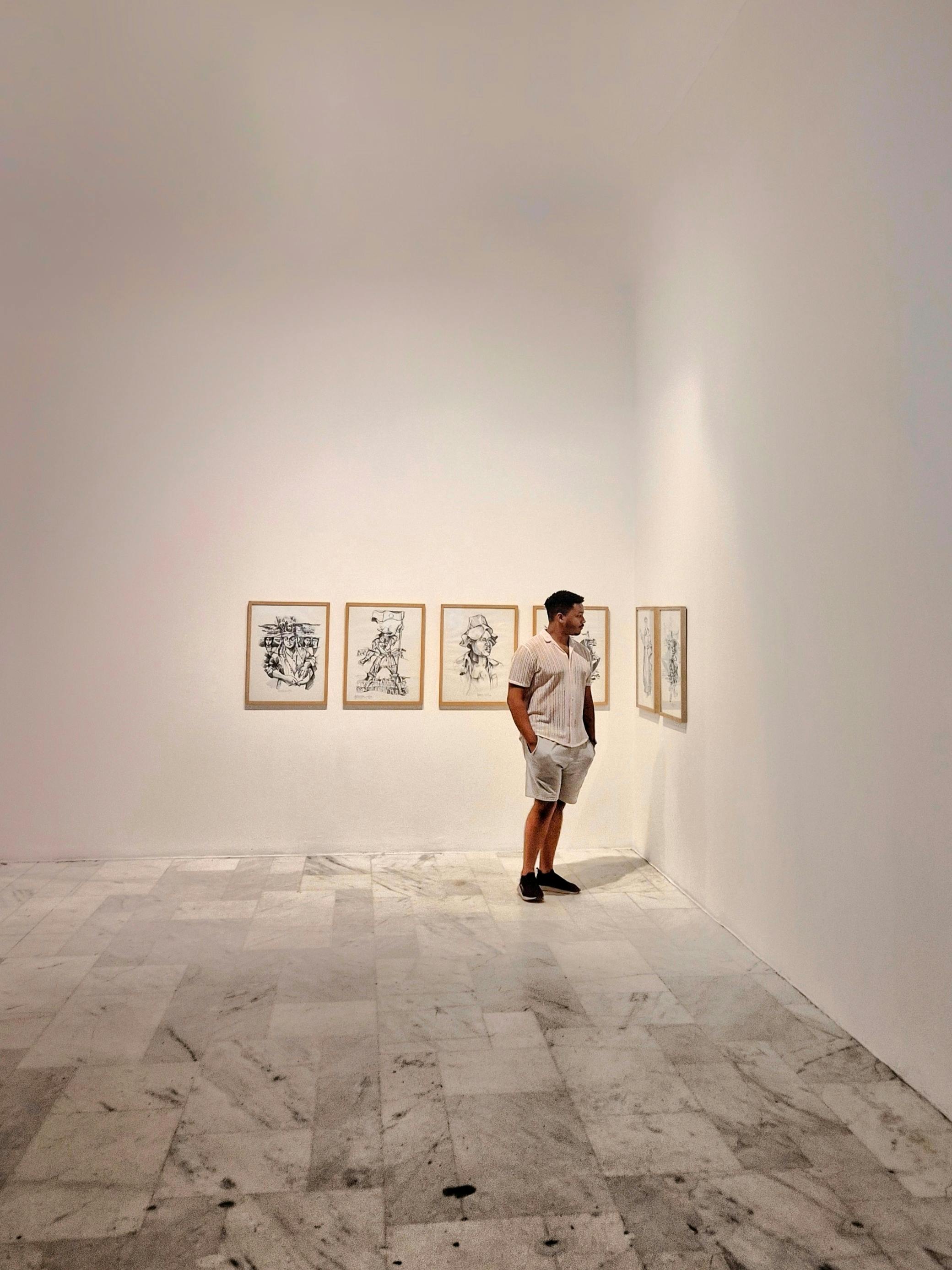 Contemplating Art in Minimalist Gallery · Free Stock Photo