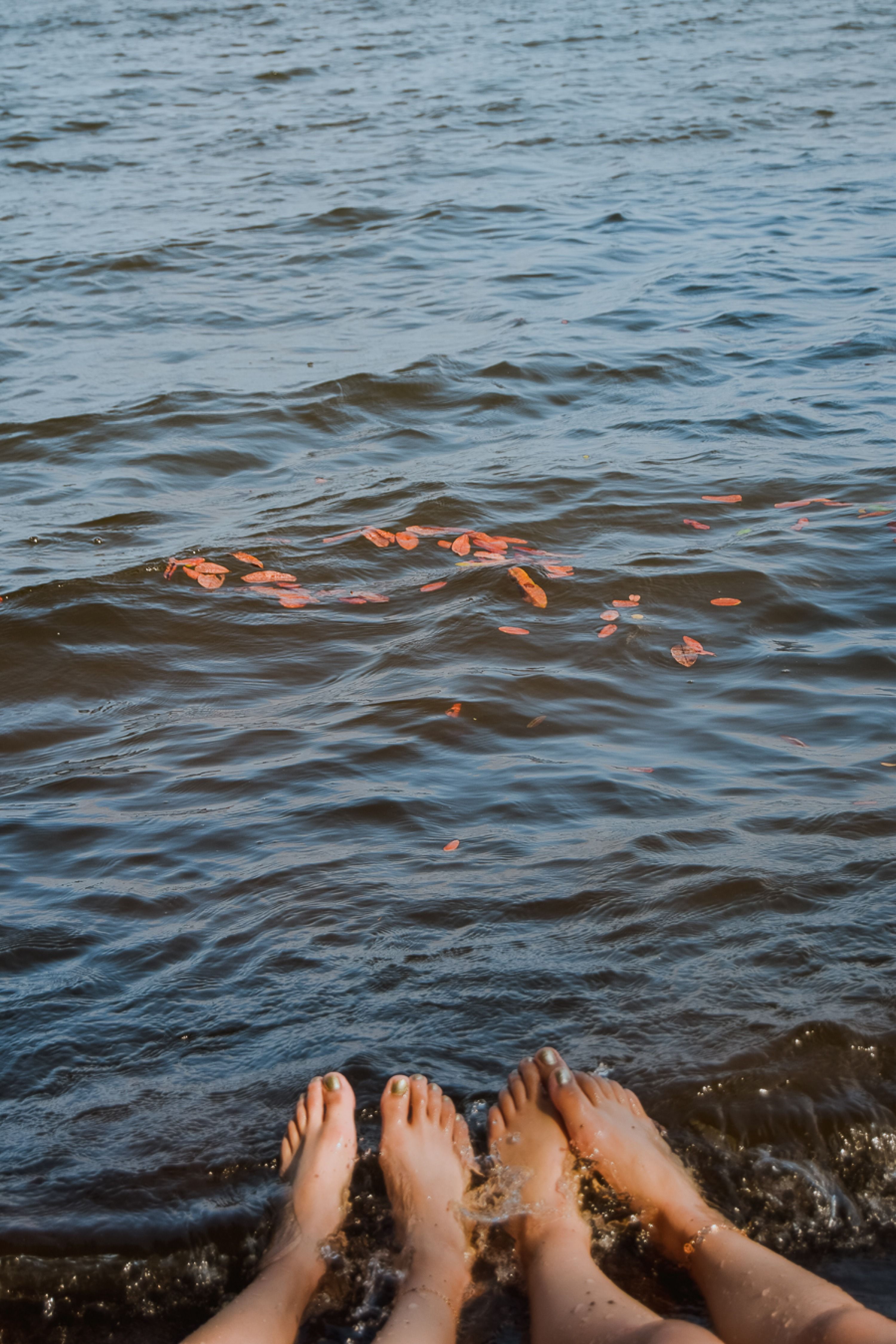 Relaxing by the Lake with Feet in the Water · Free Stock Photo