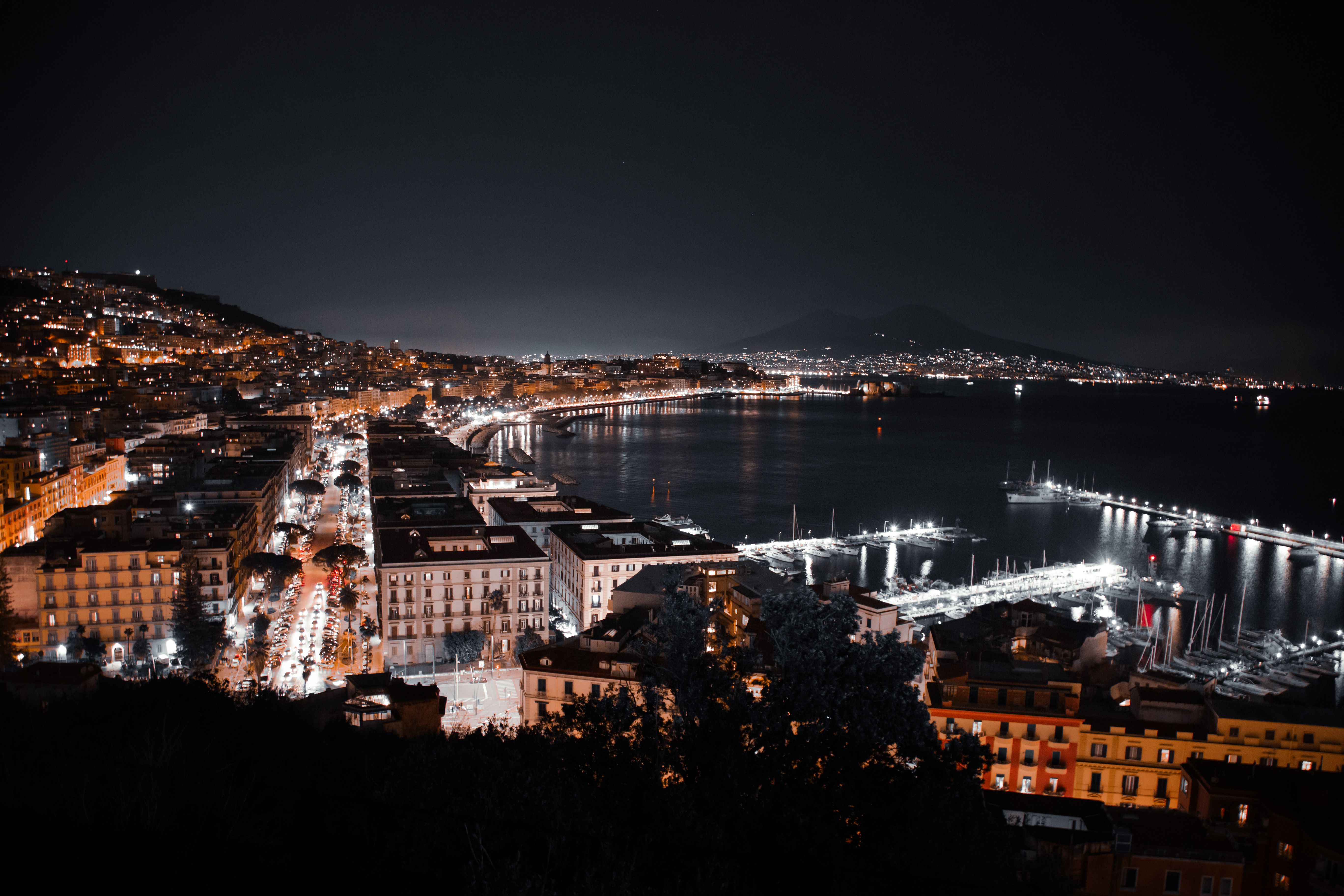 Stunning Night Aerial View of Naples Coastline · Free Stock Photo