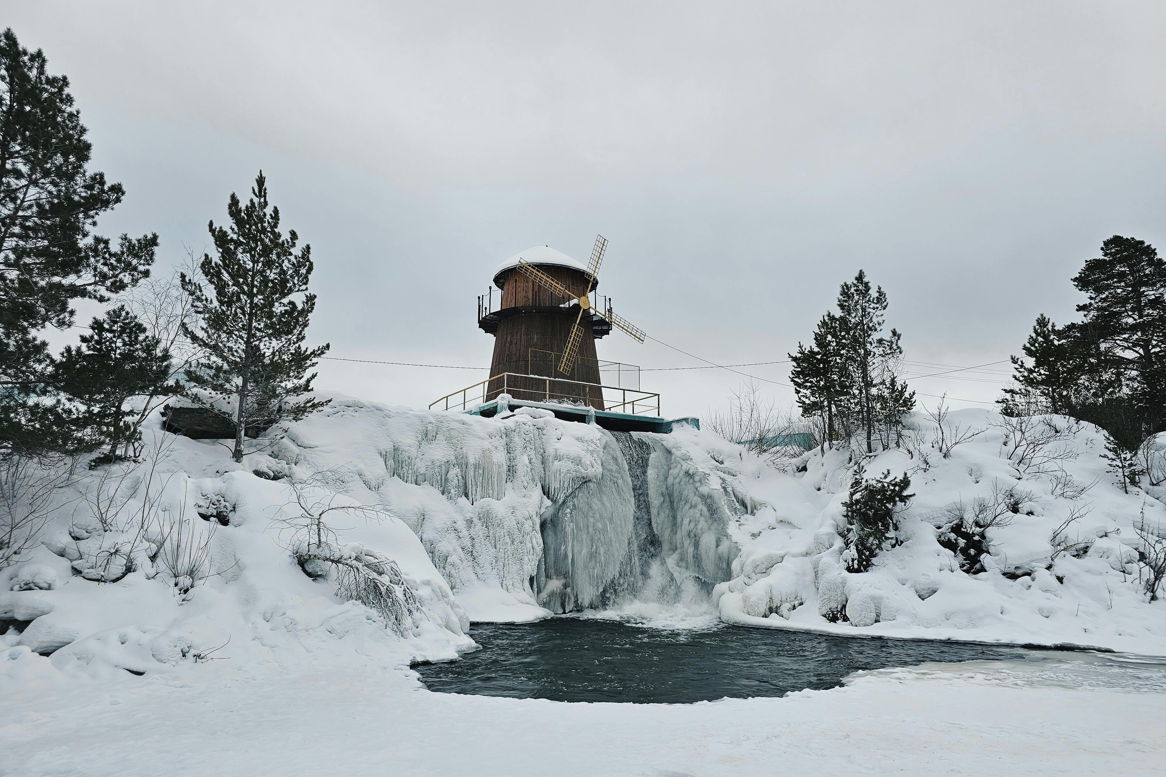 Rustic Windmill in Snowy Winter Landscape · Free Stock Photo