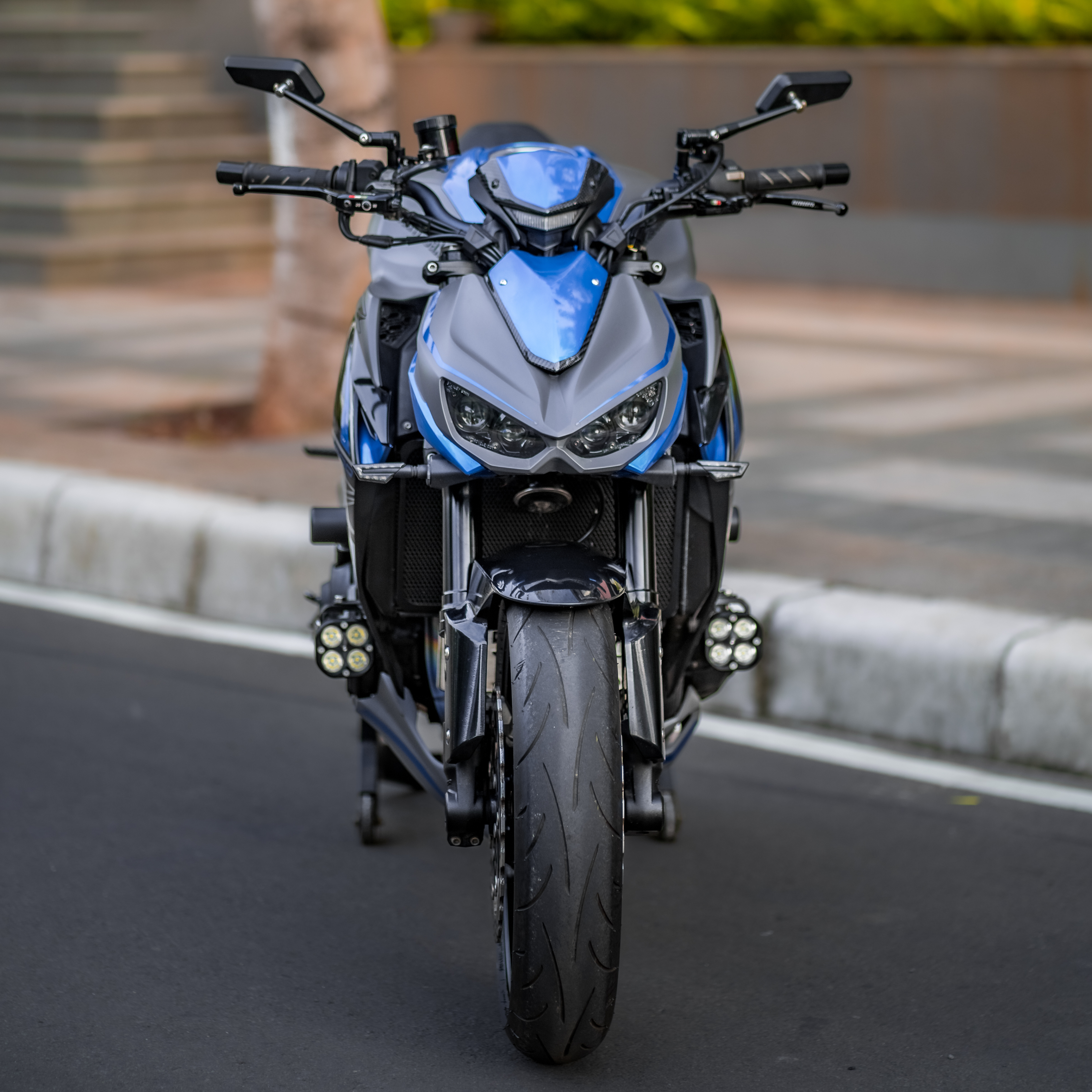 Blue Sport Motorcycle on Urban Street in Indonesia · Free Stock Photo