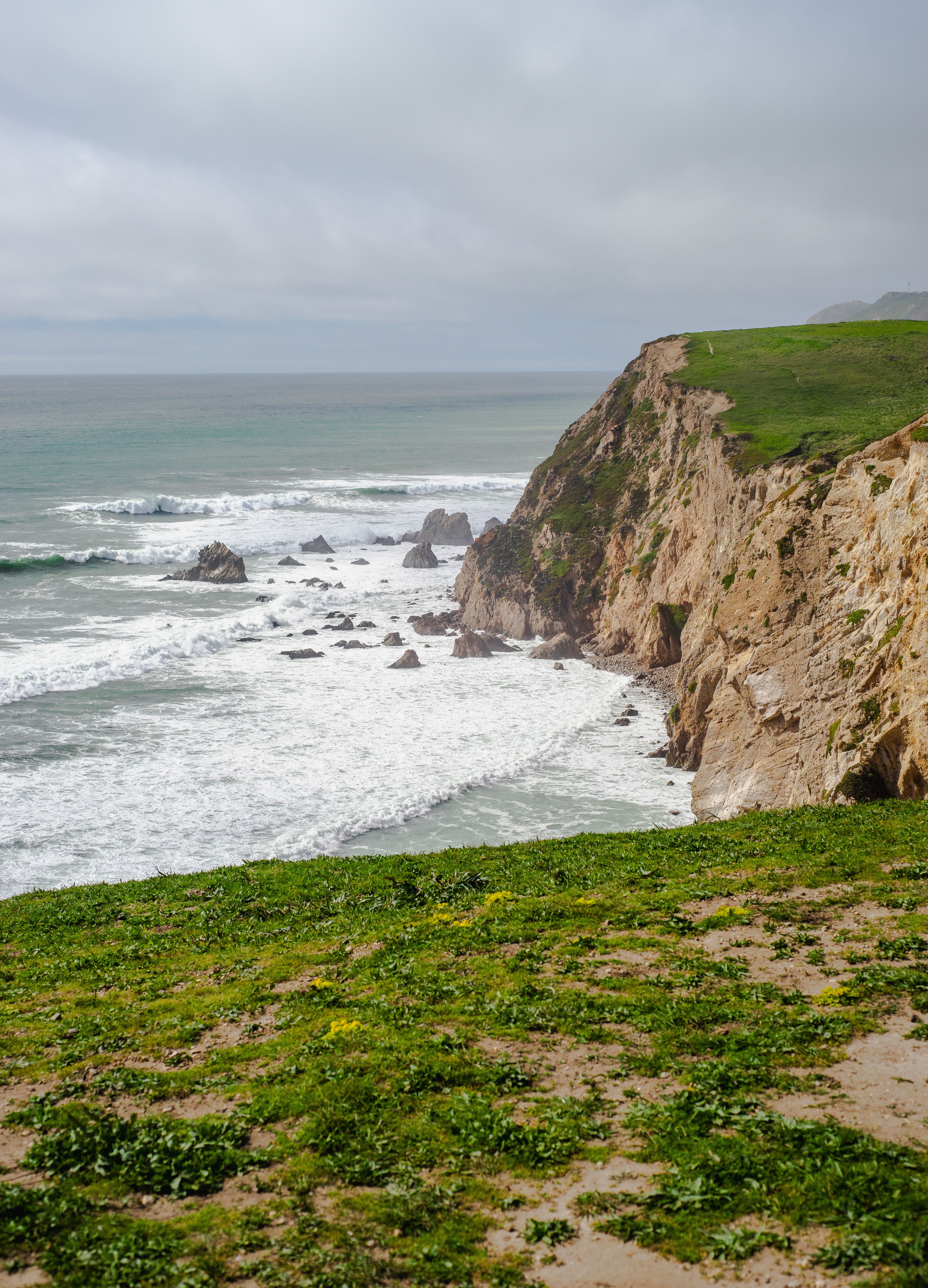 Dramatic Coastal Cliffs with Waves Crashing · Free Stock Photo