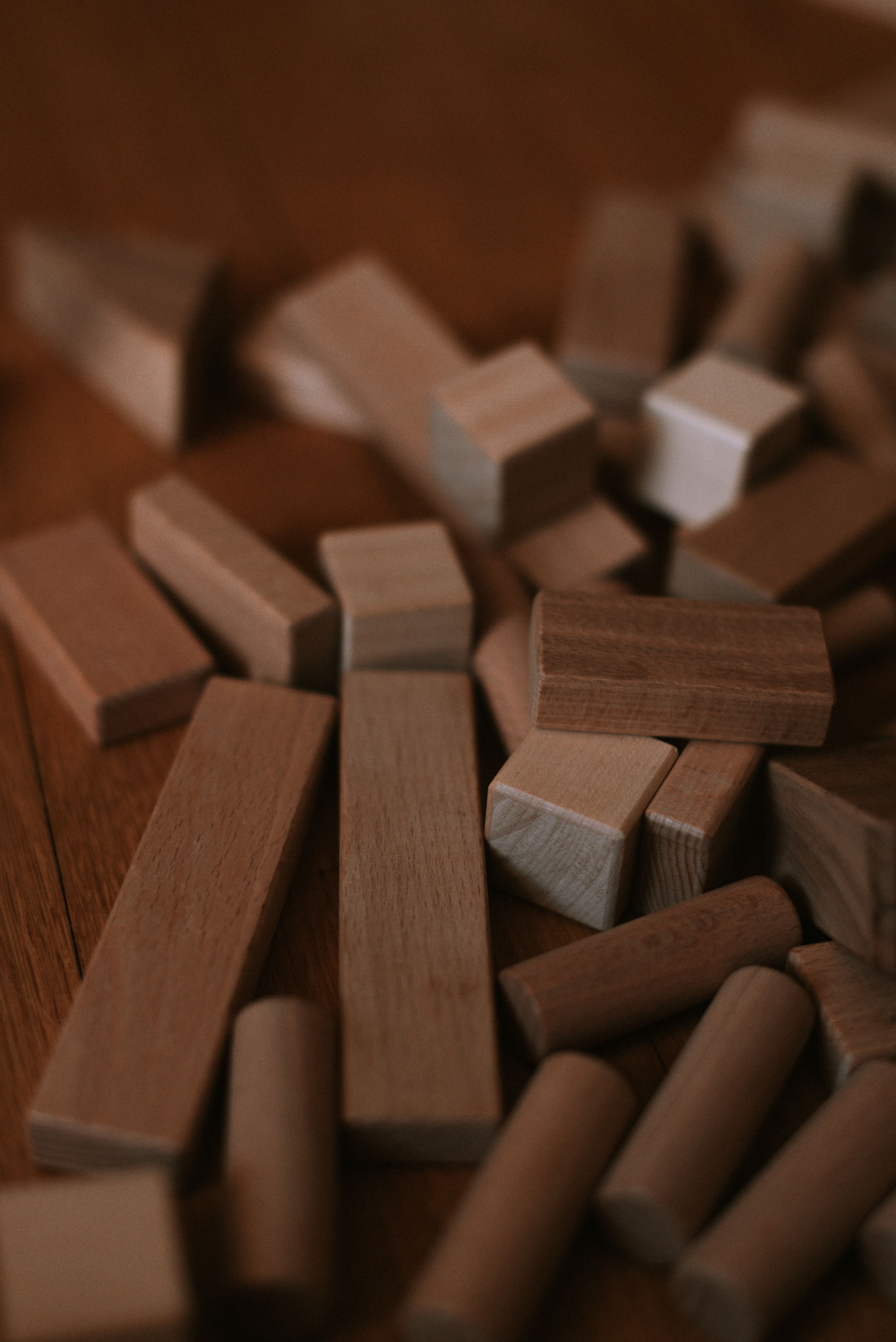 Close-Up of Wooden Building Blocks on Floor · Free Stock Photo