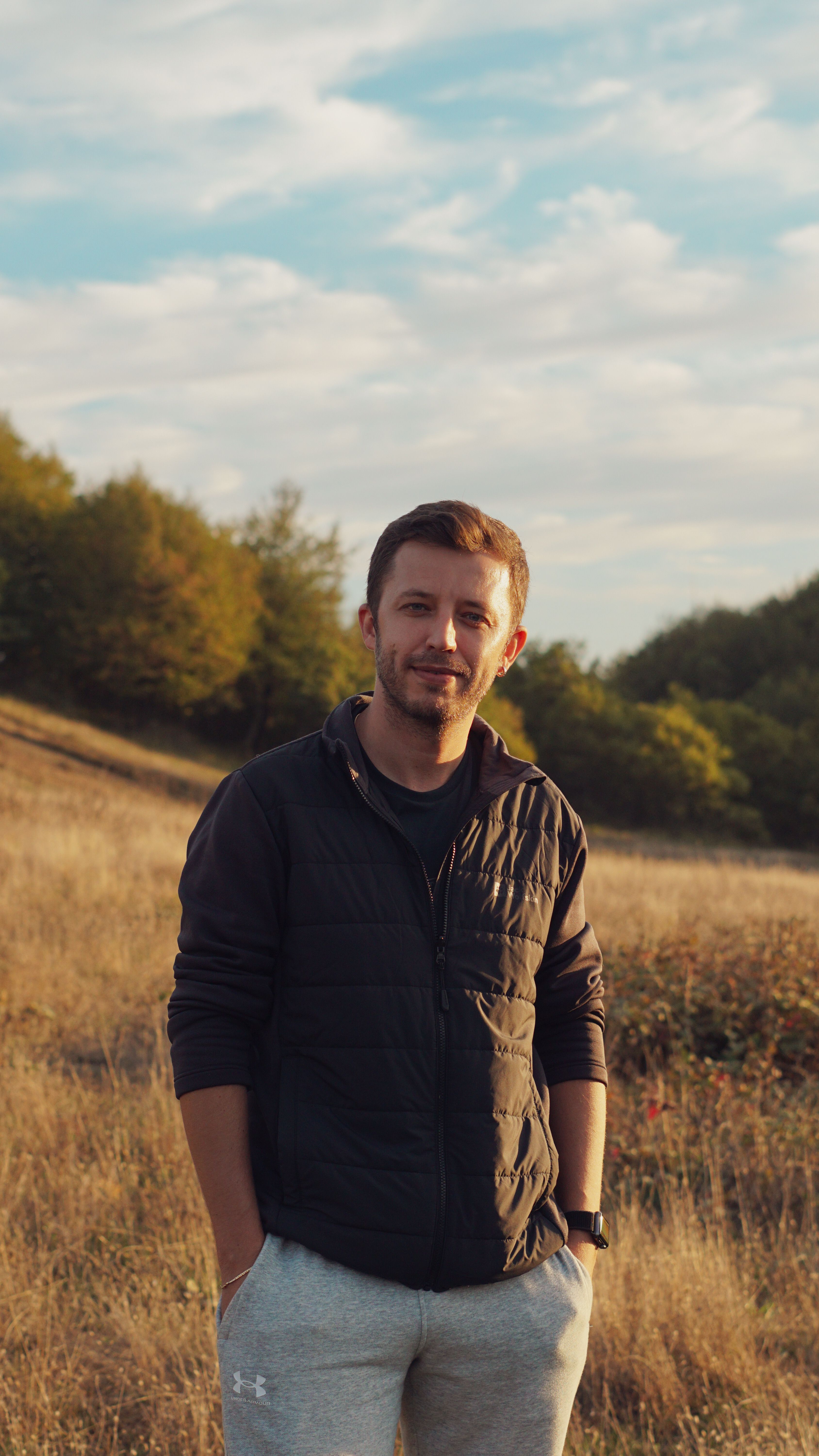 Young Man Enjoying Autumn Outdoors in Warm Light · Free Stock Photo